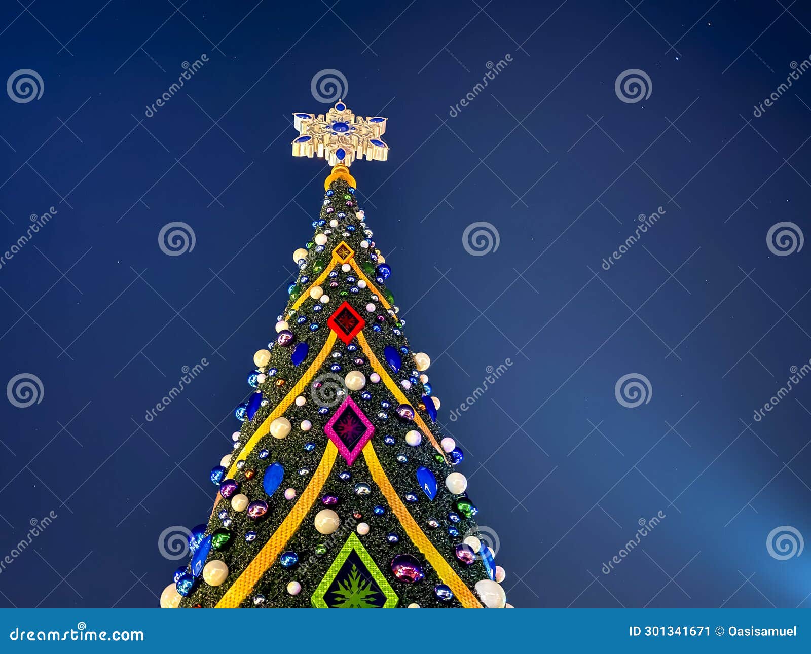 A Horizontal View of a Christmas Tree that Lit Up in Various Colours ...