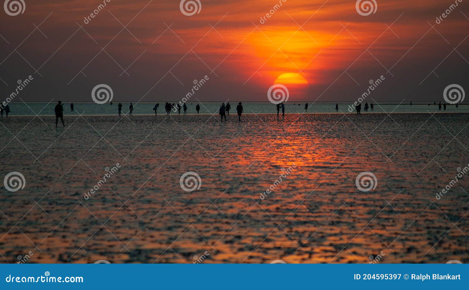 Horizontal View on People at the Beach and Watt in Front of the Setting ...