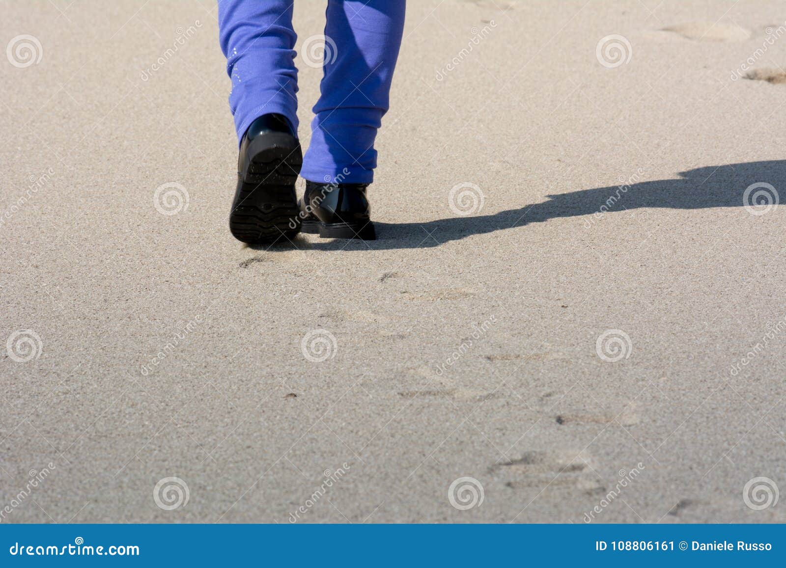 Horizontal View of a Person Walking on Sand Making Footprints on Stock ...