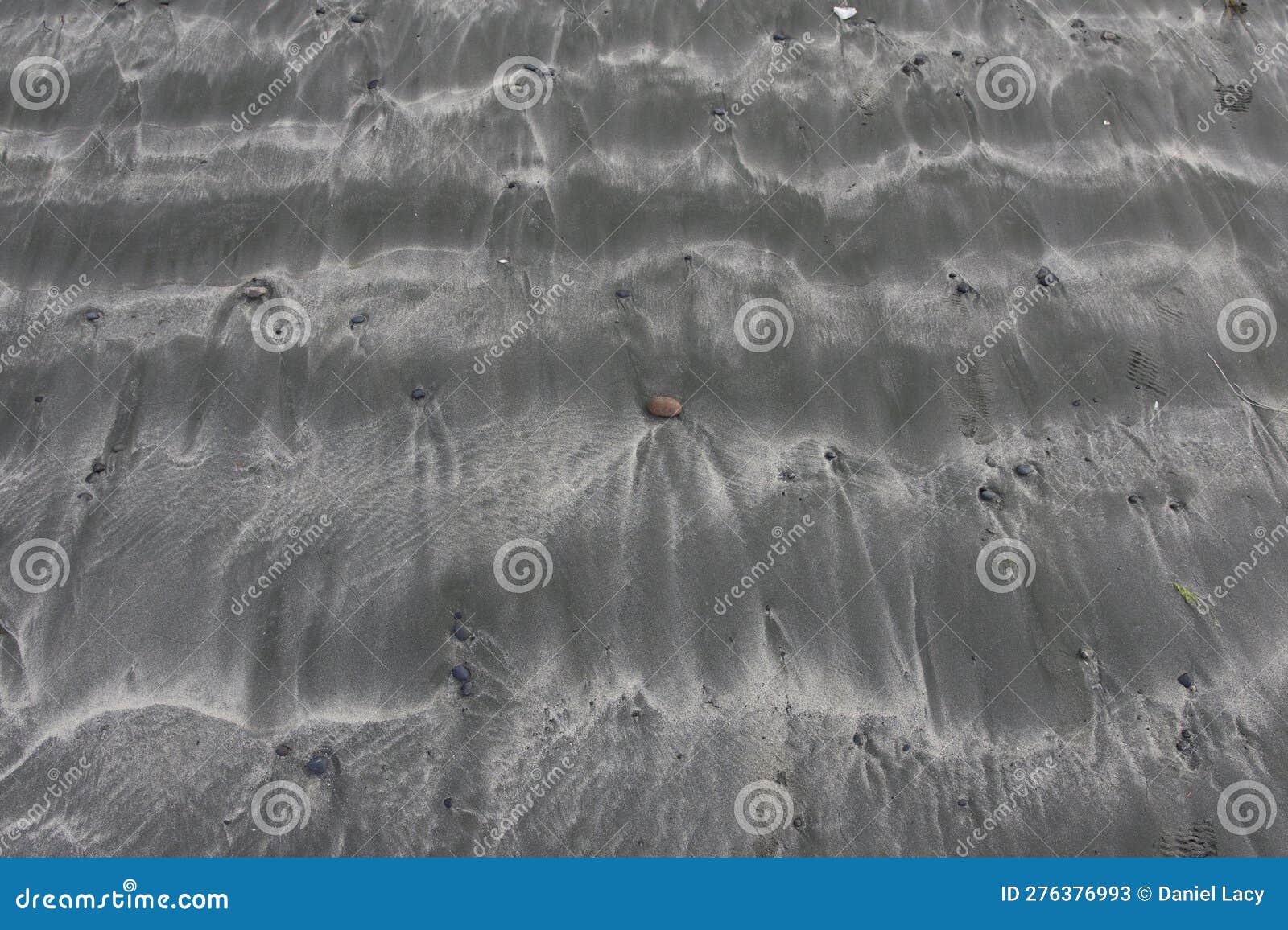 Horizontal Wave Pattern on Grey Sandy Beach with Pebbles Stock Image ...