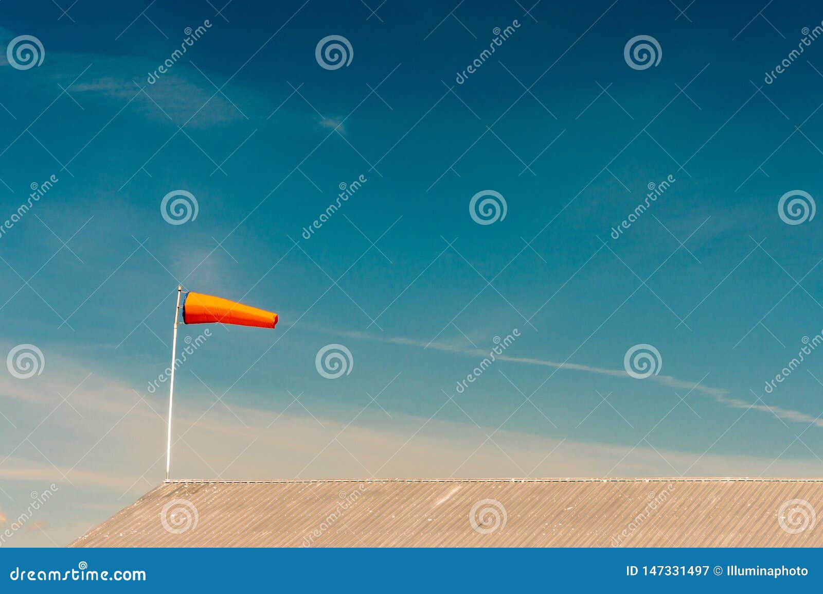 Horizontally Flying Orange Windsock on Metal Rooftop and Clear Dark ...