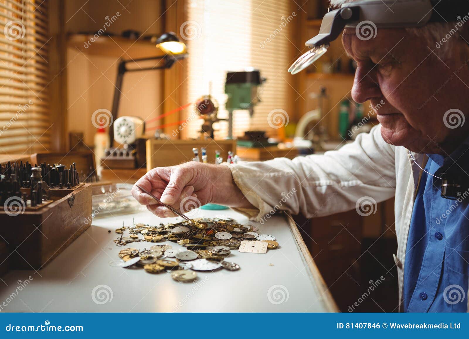 Horologist Selecting a Clock Dial with Tweezers Stock Photo - Image of ...