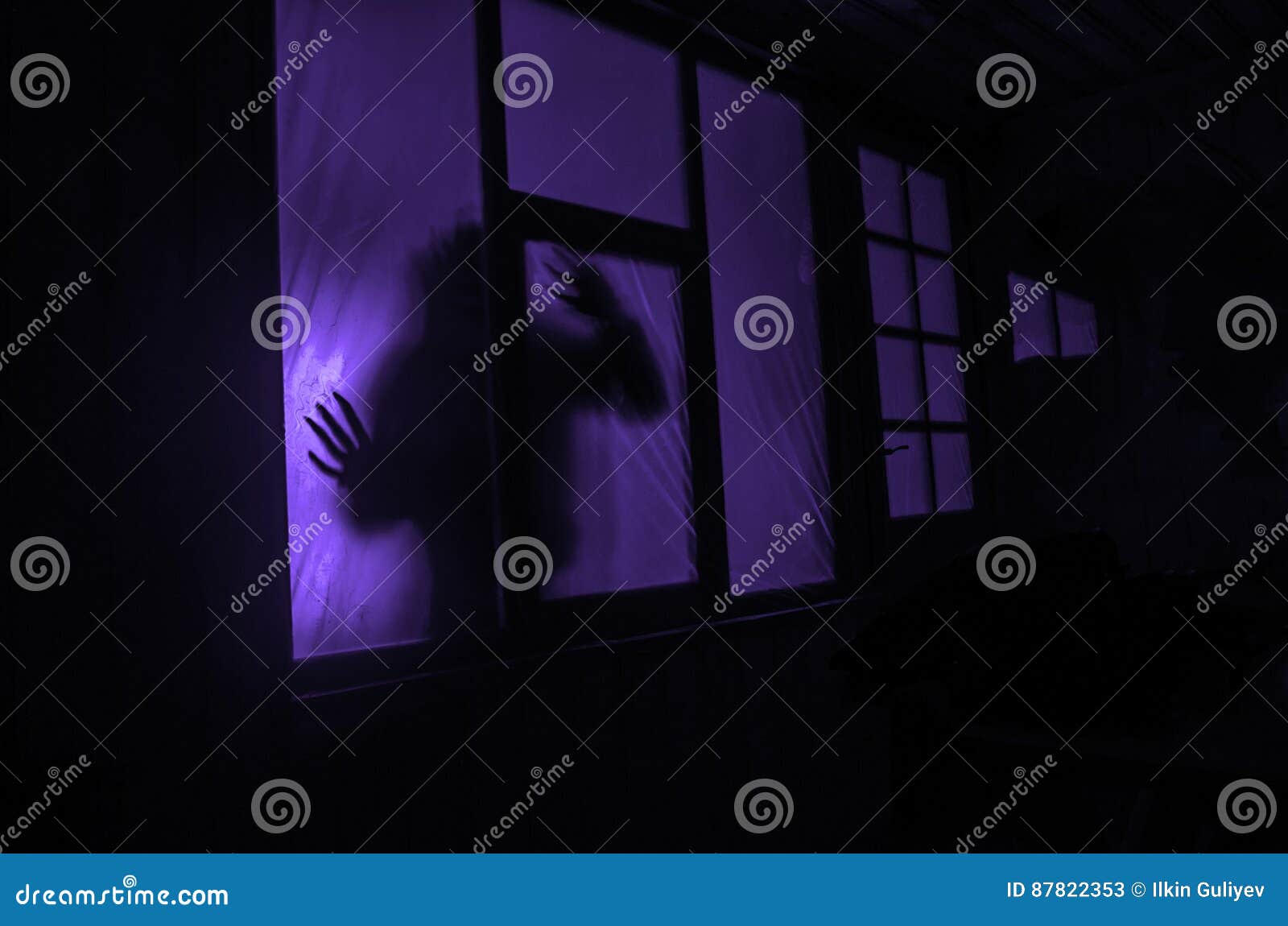 Horror Concept. the Silhouette of a Human with Sprayed Arms in Front of ...