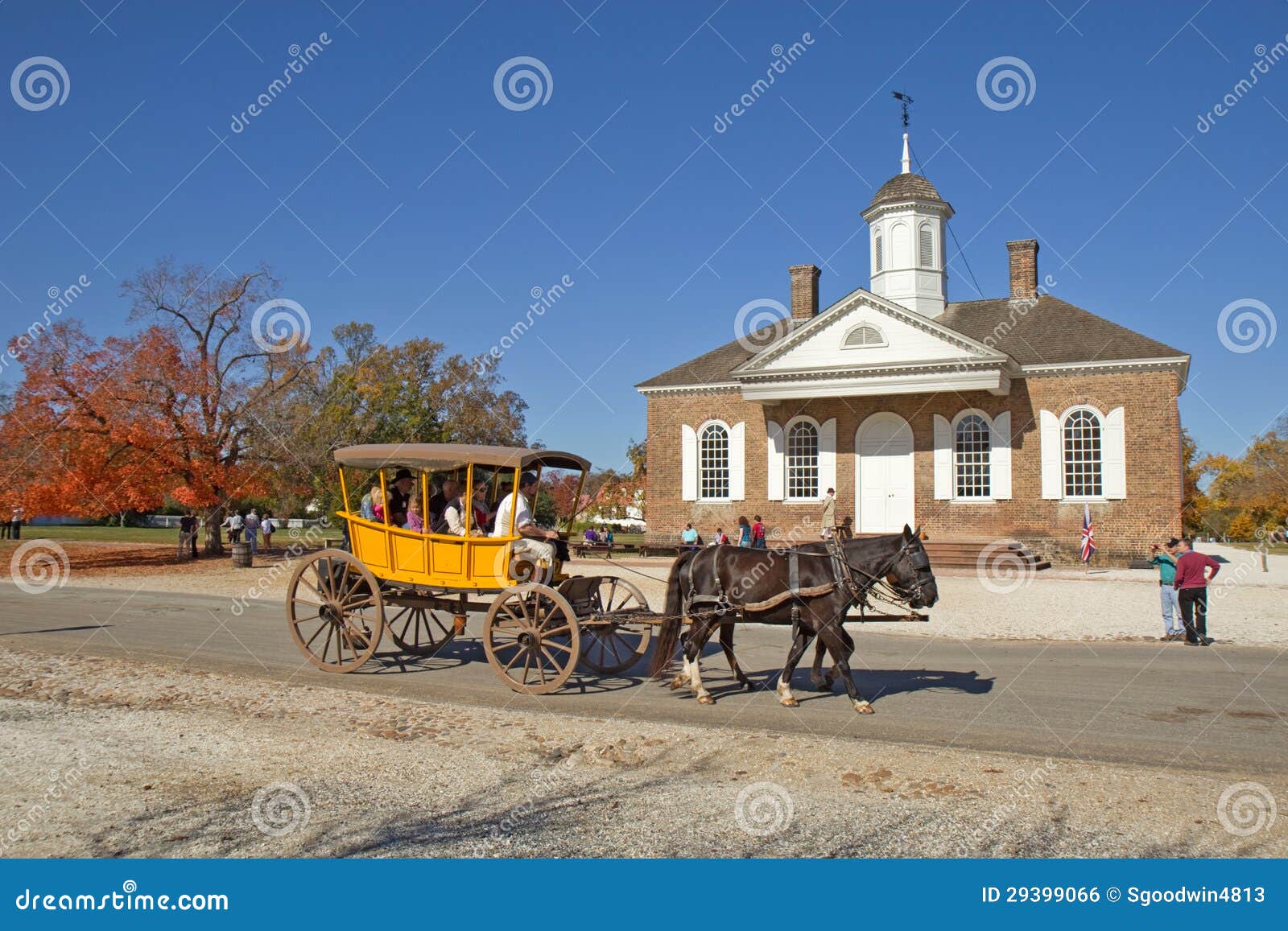A Horse-drawn Carriage Rides in Front of the Courthouse Building ...