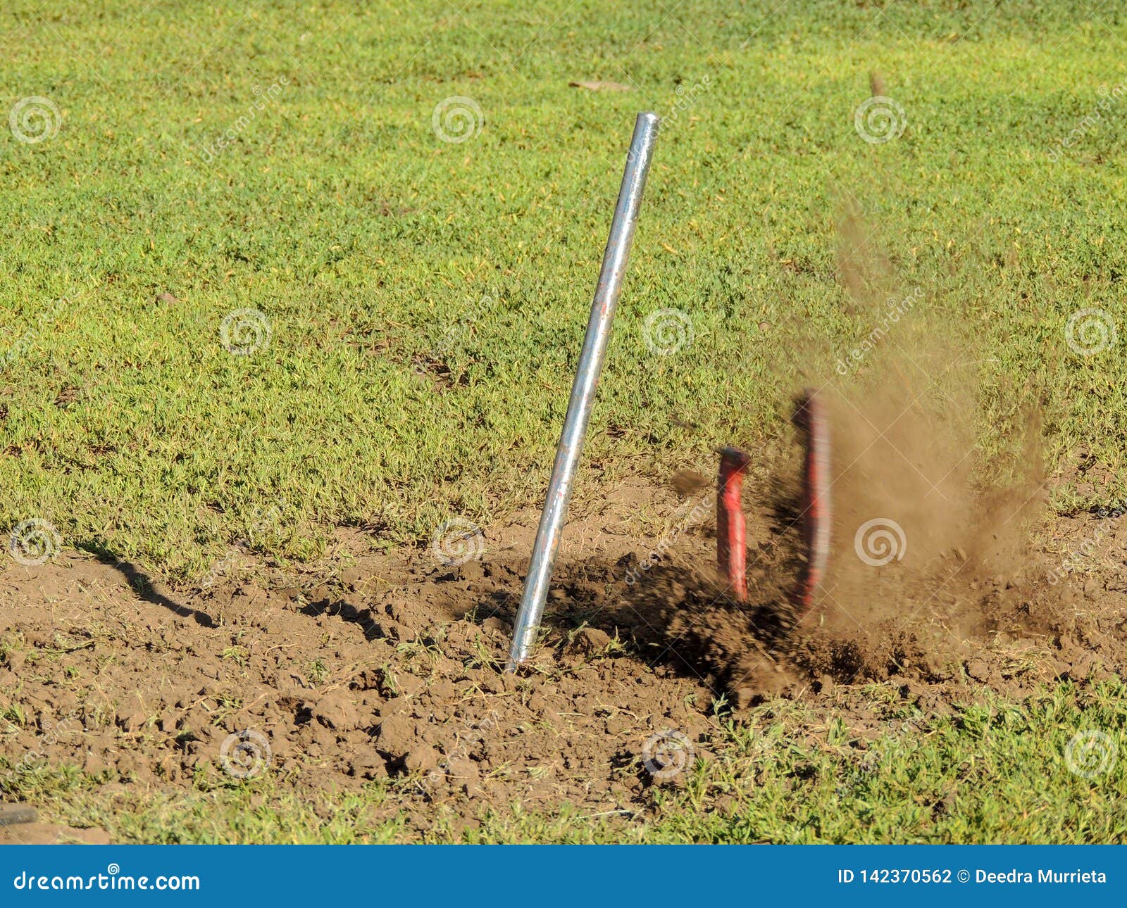 Horseshoe Game Possible Ringer with Dirt Flying Stock Photo - Image of ...