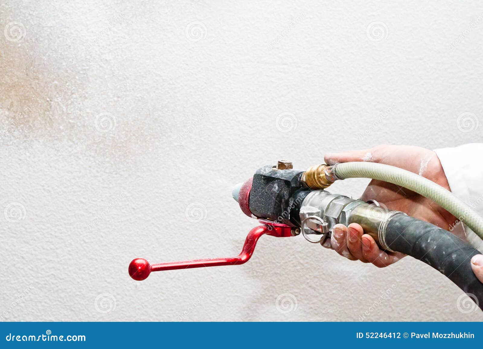 Hose machine spackling stock photo. Image of apartment - 52246412