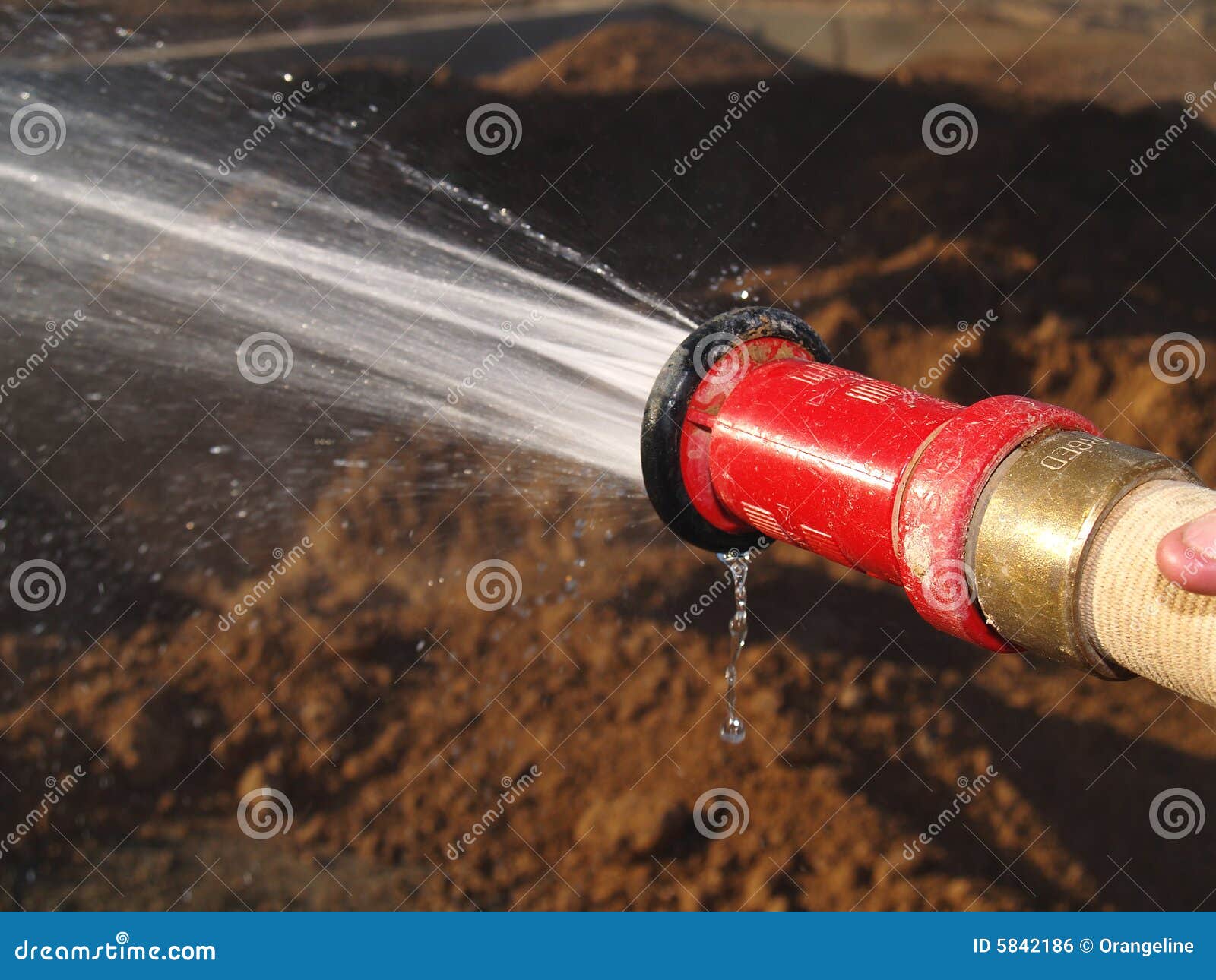 Hose Spraying Water on Ground - Horizontal Stock Photo - Image of ...