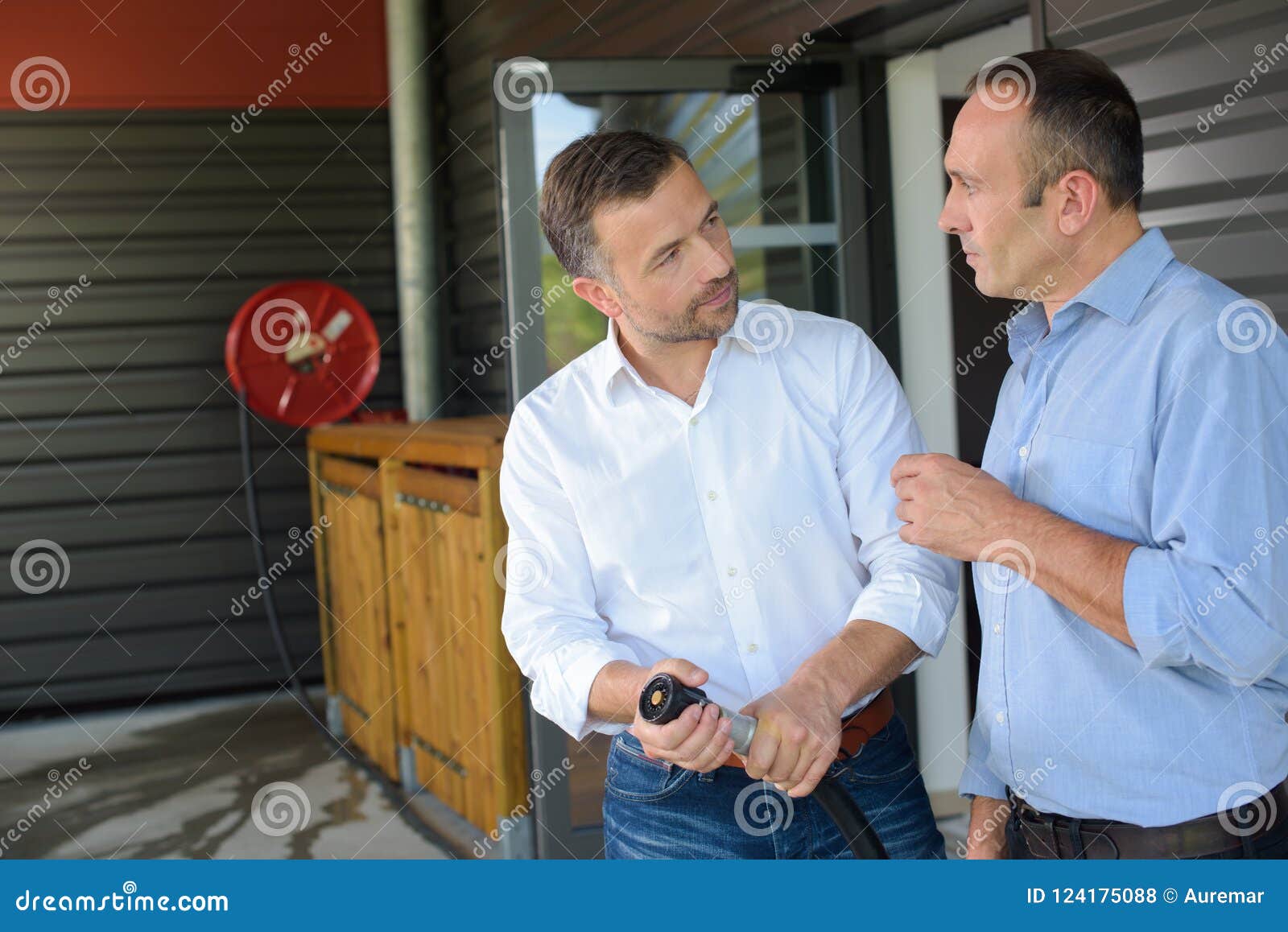 Hosing down a terrace stock photo. Image of house, home - 124175088