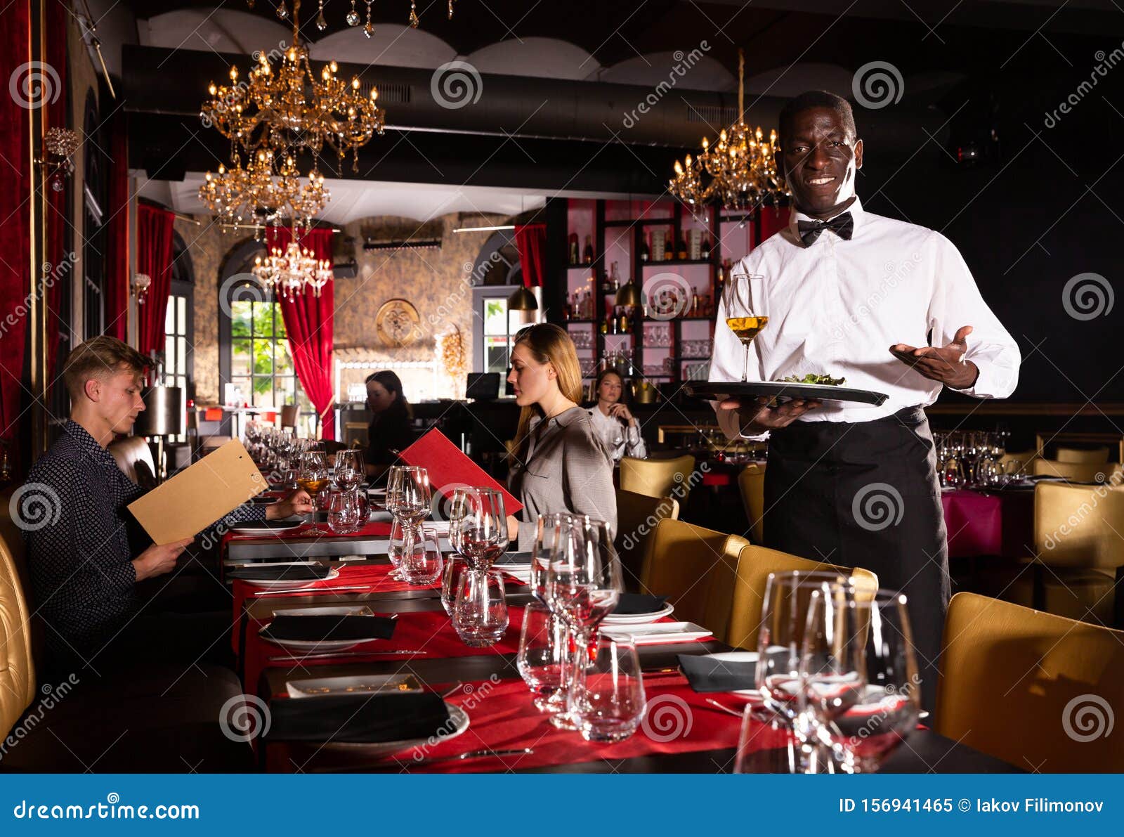 Hospitable African American Waiter Standing With Serving Tray Meeting