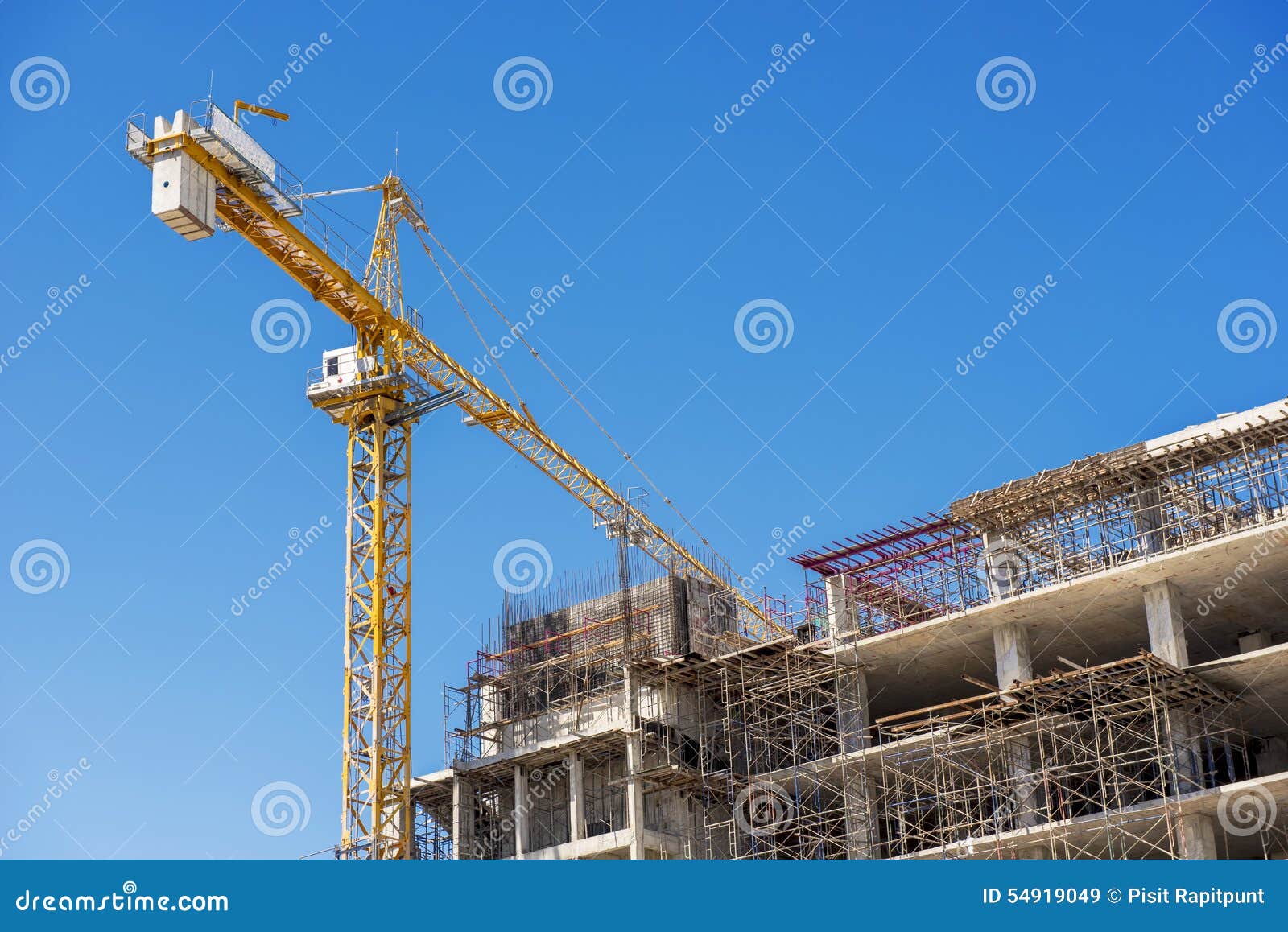 Hospital Building Under Construction with Cranes Against a Blue Sky ...