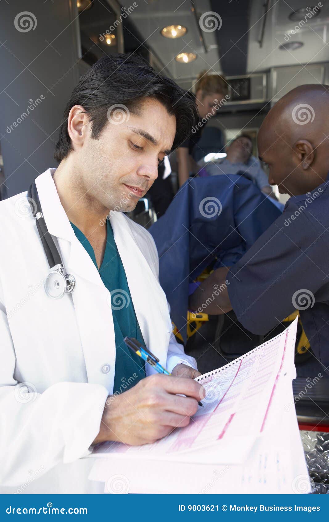 Hospital Doctor Taking Notes Paramedics Stock Image - Image of american ...