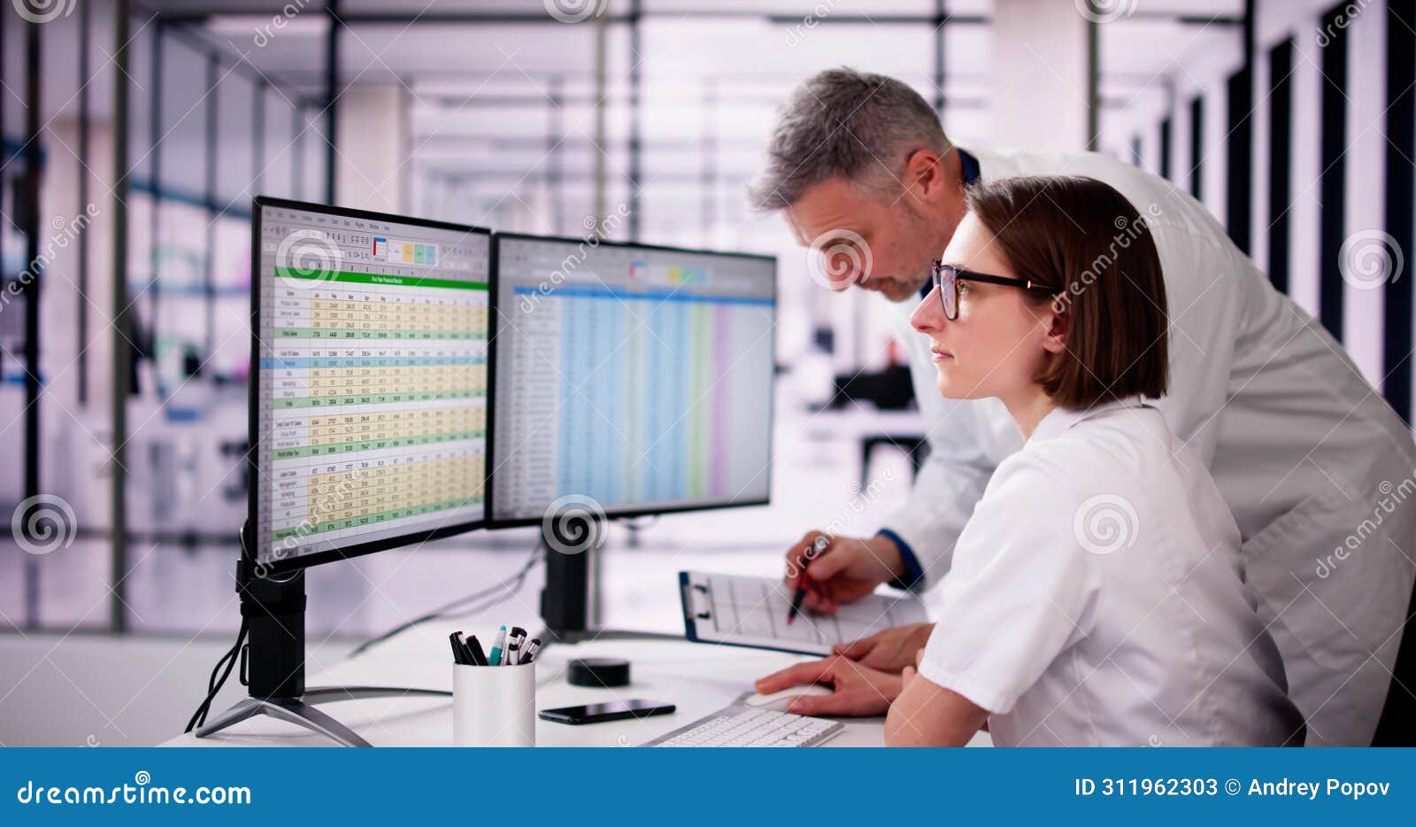 Hospital Doctor Using Spreadsheet for Billing Codes Stock Image - Image ...