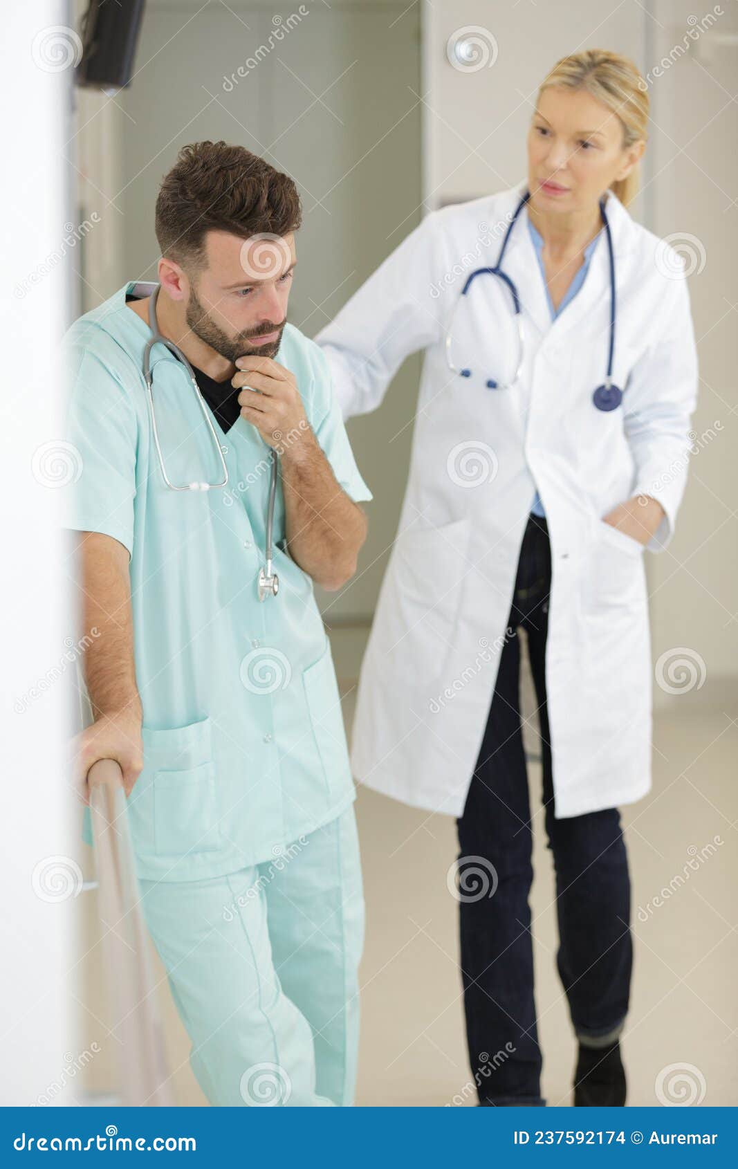 In Hospital Doctors Have Discussion in Corridor Stock Photo - Image of ...