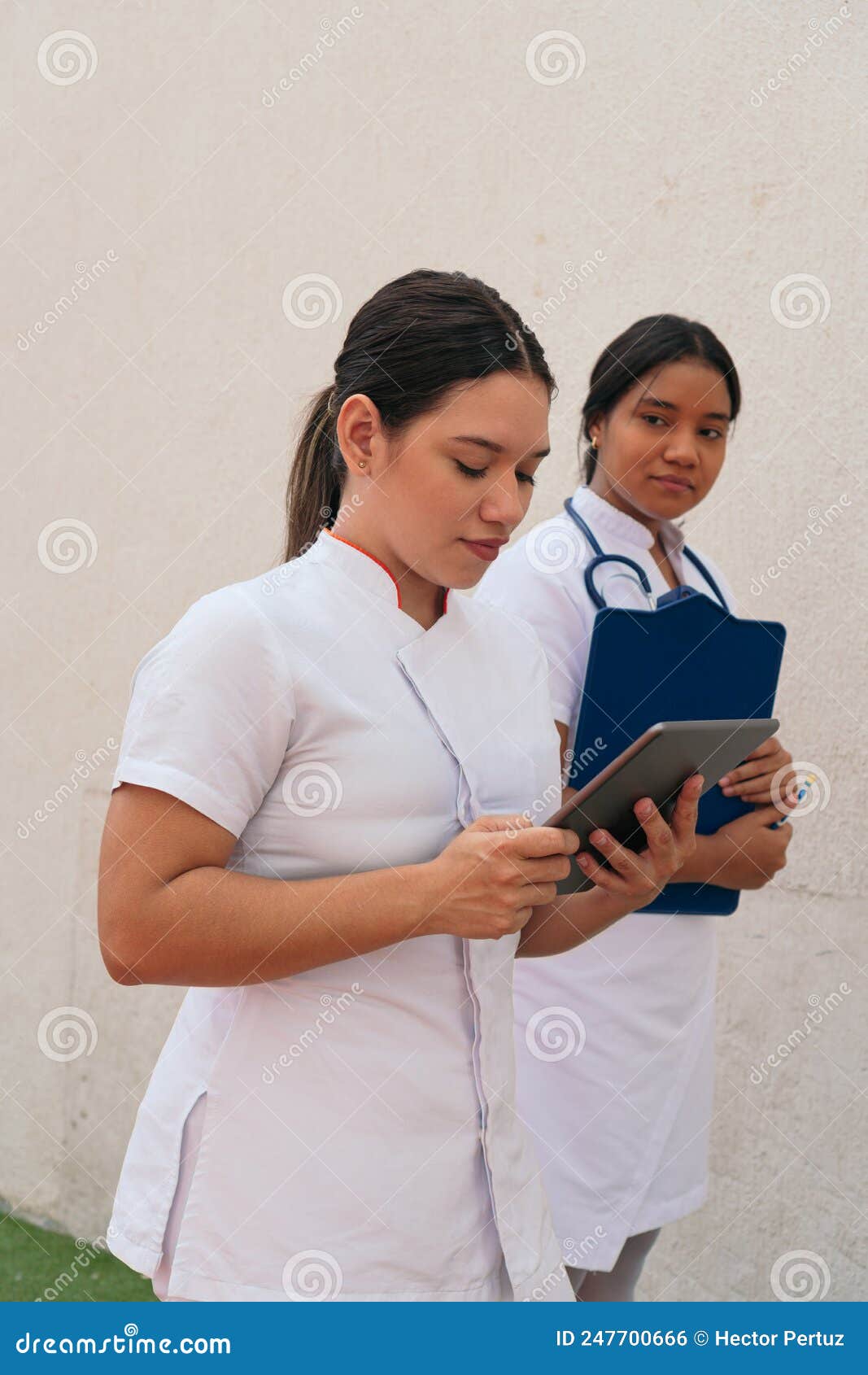 Hospital: Nurse Uses Tablet To Check Messages Stock Photo - Image of ...