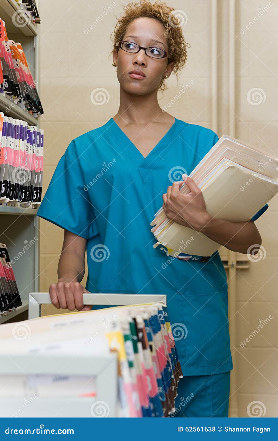 Hospital Orderly in Archives Stock Photo - Image of book, information ...