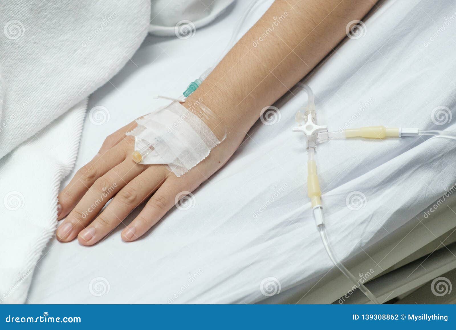 Patient Hand with Saline Solution in Intravenous Drip Dropper Stock ...