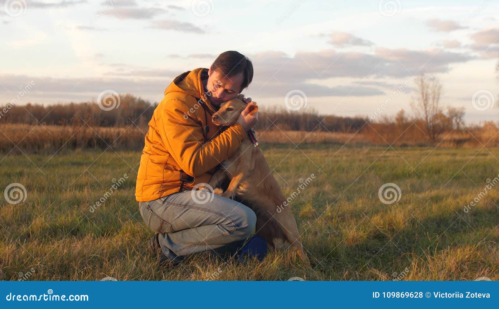 Host is Hugging Dog, Playing with the Pet in Park Stock Photo - Image ...