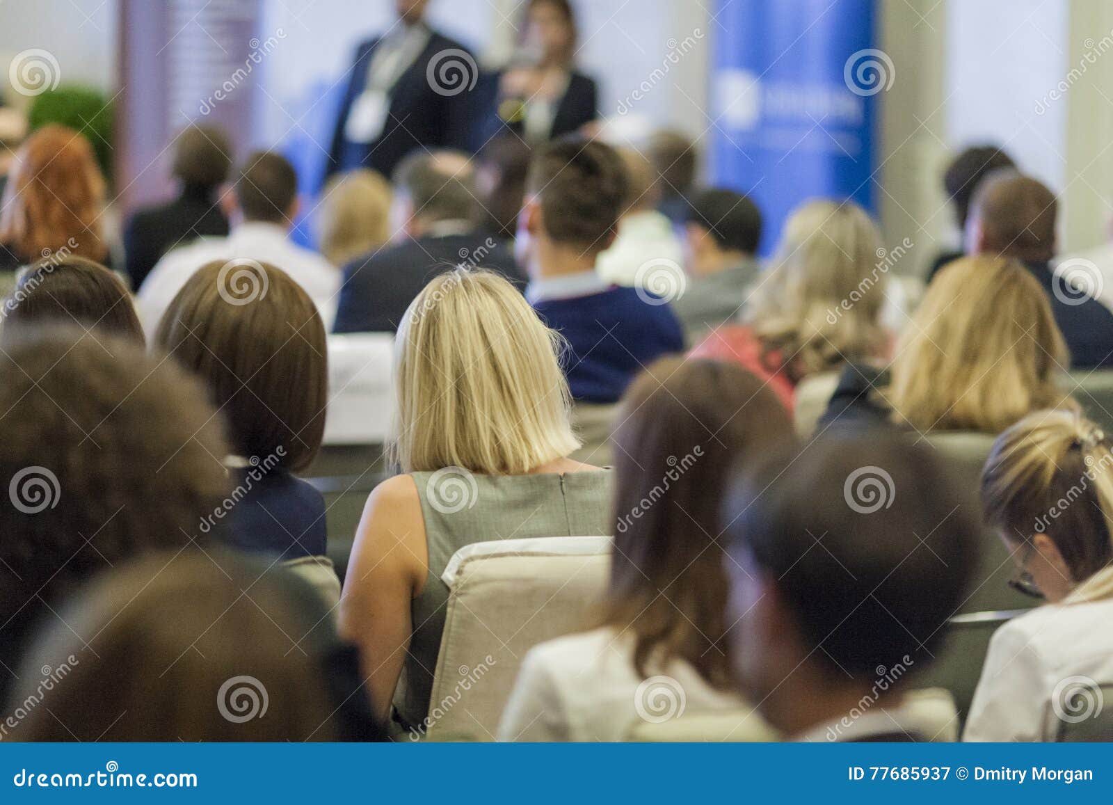 Host Speakers Talking in Front of the Audience during the Conference ...