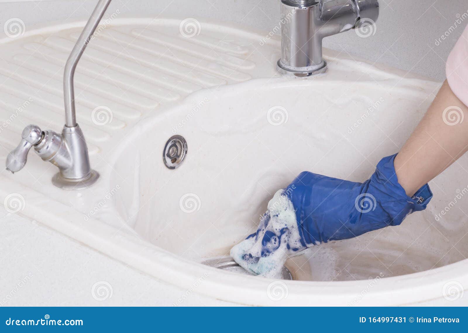 The Hostess Started Cleaning the Kitchen Washes the Sink Stock Image ...