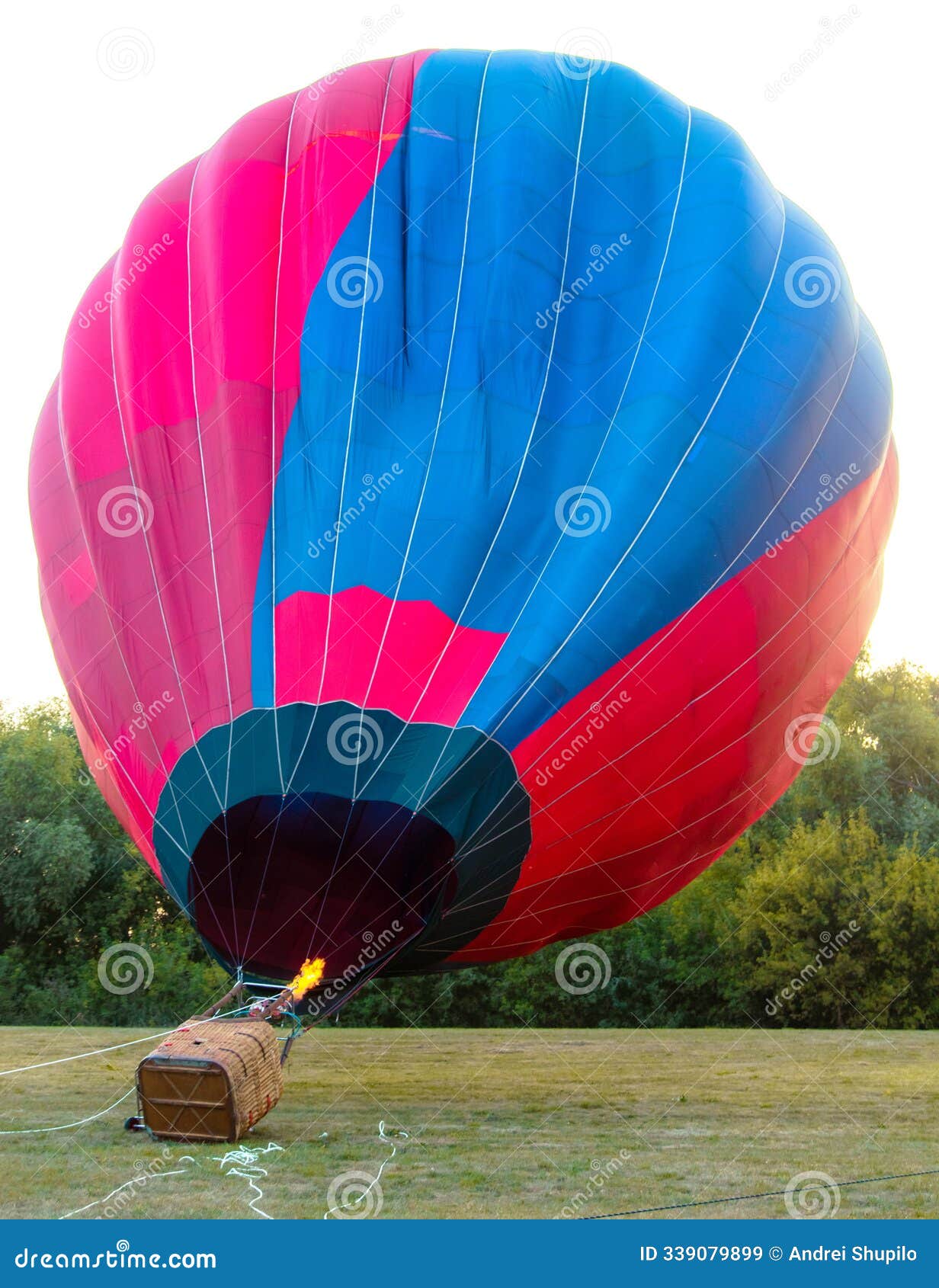 A Hot Air Balloon is in the Air with a Fire Burning Inside Stock Image ...