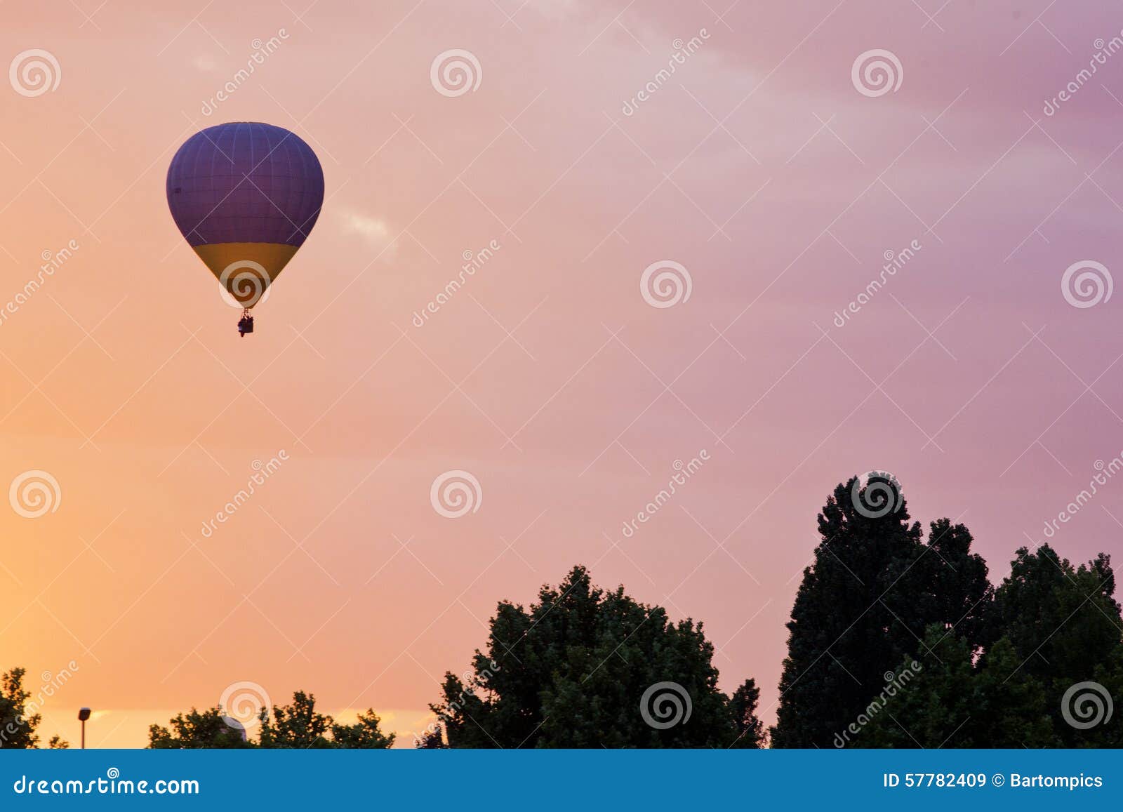 A Hot Air Balloon Flying in the Sunset Stock Image - Image of ballon ...