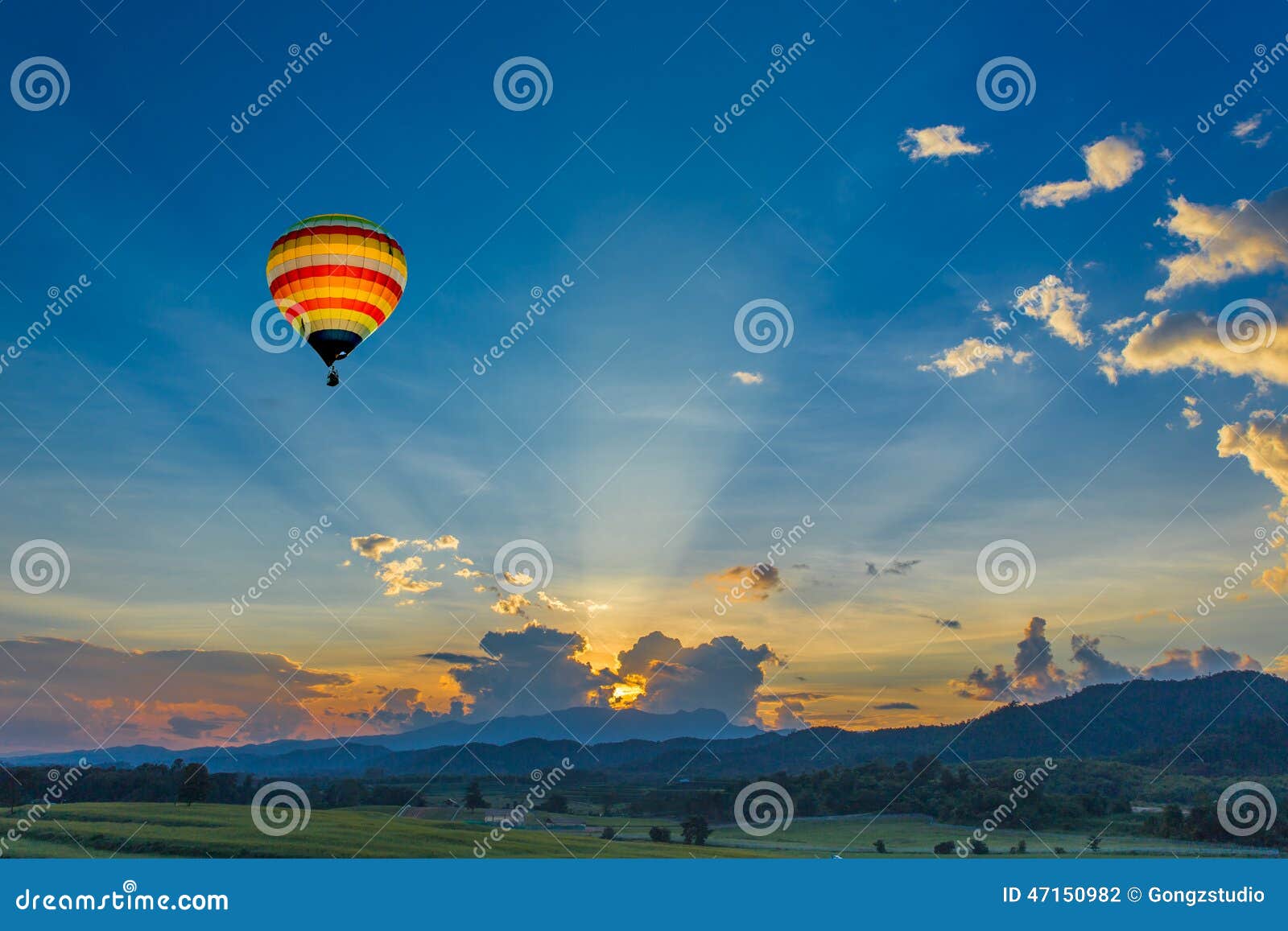 Hot Air Balloon Over the Fields at Sunset Stock Photo - Image of park ...
