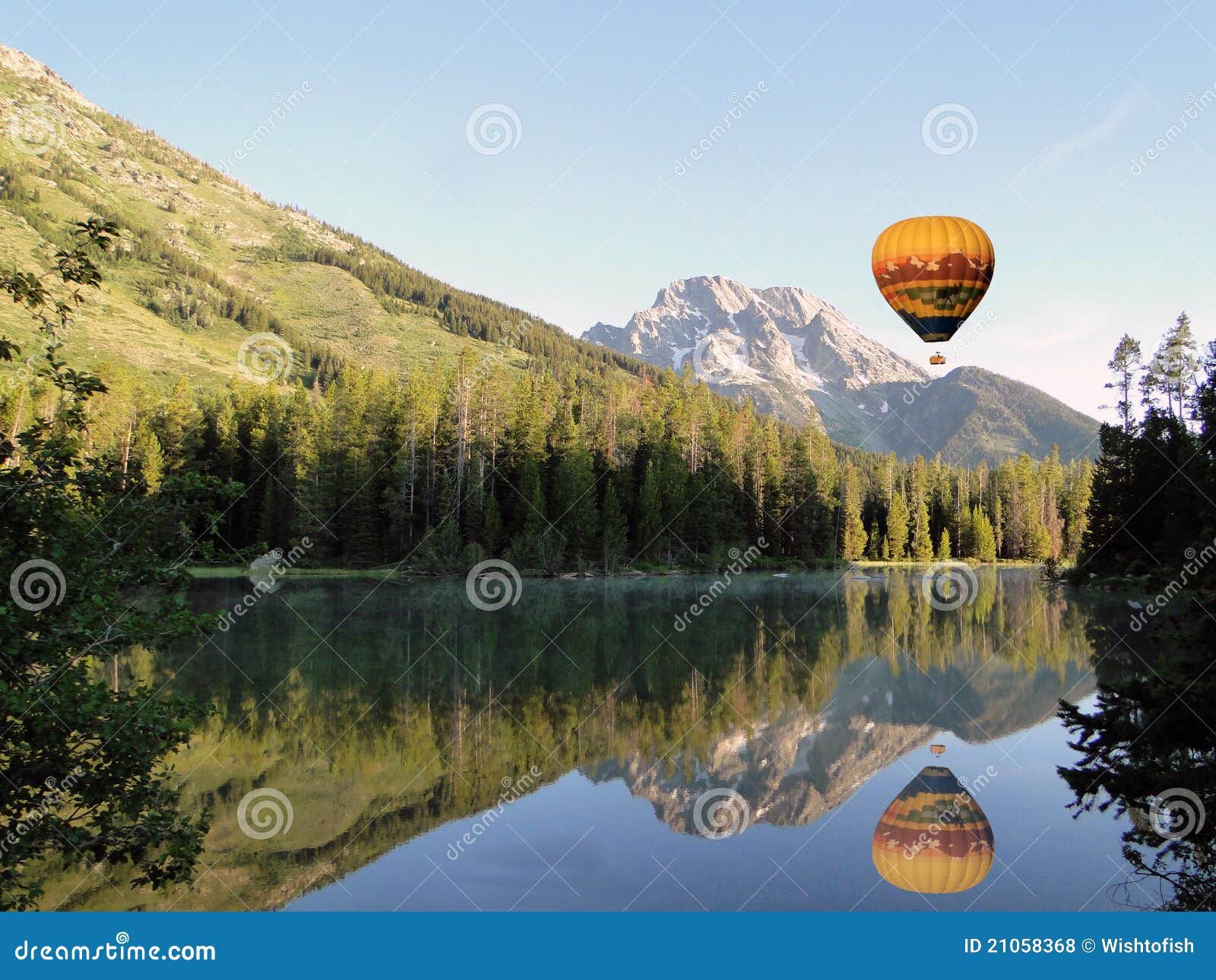 Hot air balloon over lake stock photo. Image of mountain - 21058368