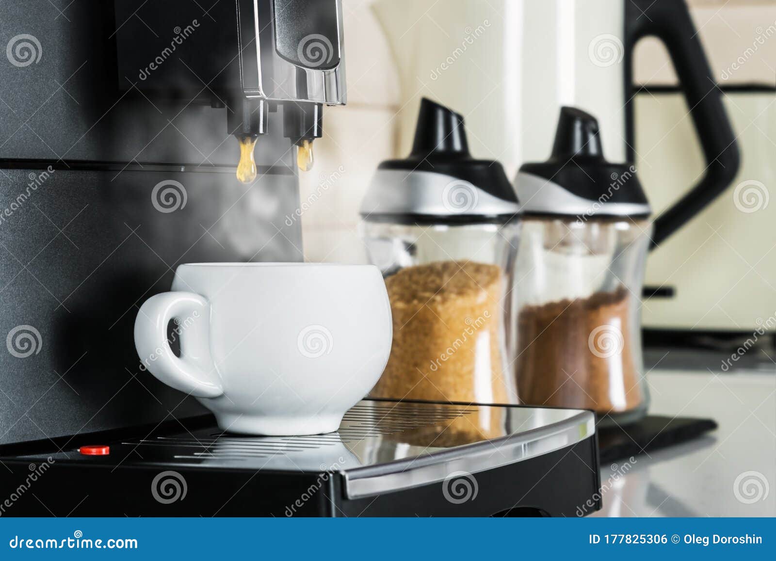 Hot Coffee from the Coffee Machine is Poured into a White Cup Stock ...