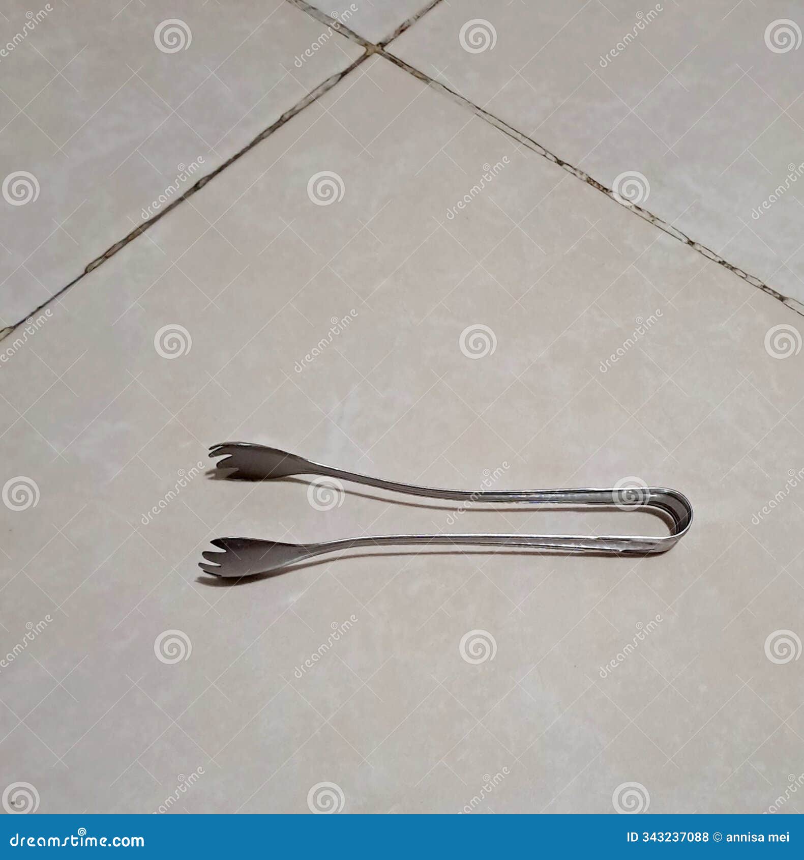 Hot Cooking Tongs for Mom in the Kitchen. Stock Photo - Image of metal ...