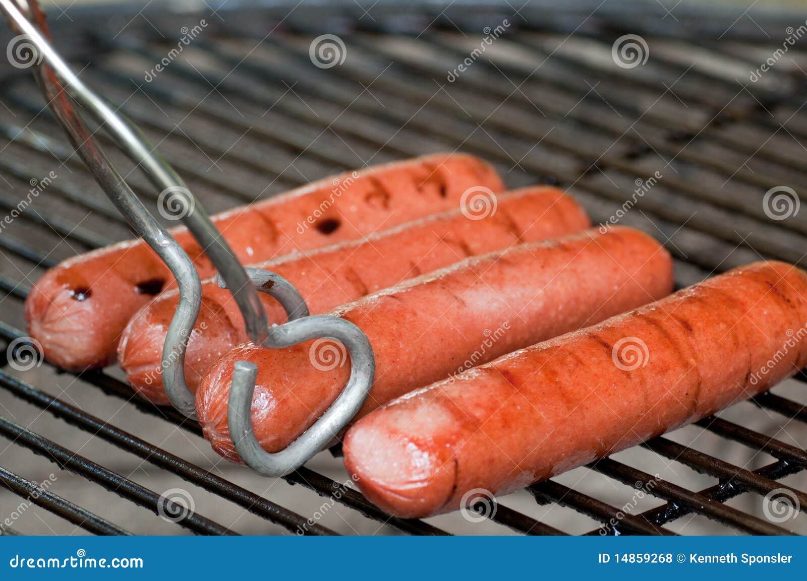 Hot dogs and tongs stock photo. Image of food, grasp - 14859268