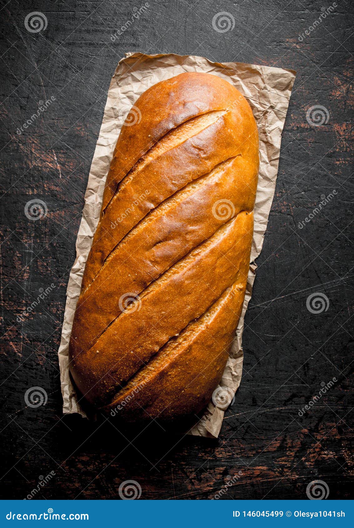 Hot fresh bread on paper stock image. Image of wheat - 146045499