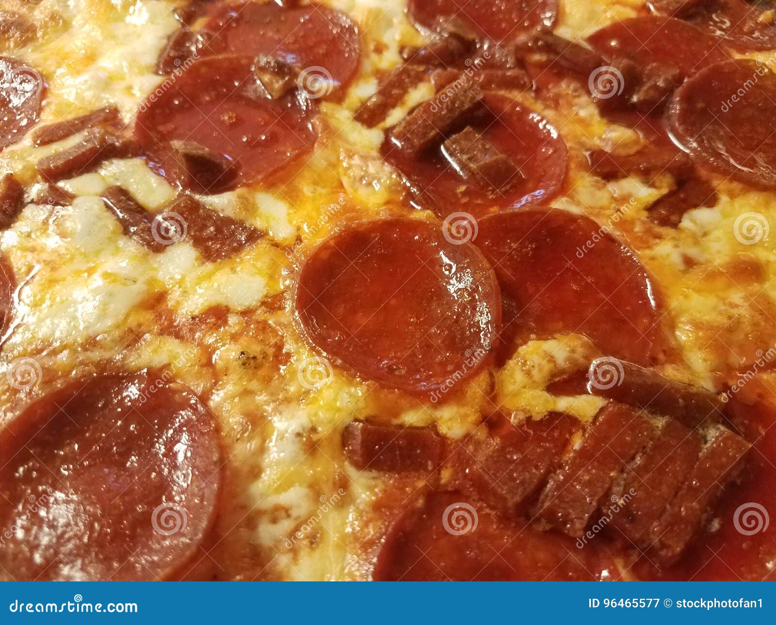 Hot greasy pepperoni pizza stock image. Image of greasy - 96465577