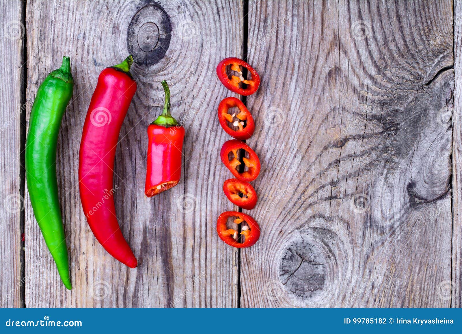 Hot pepper on wooden table stock photo. Image of closeup - 99785182