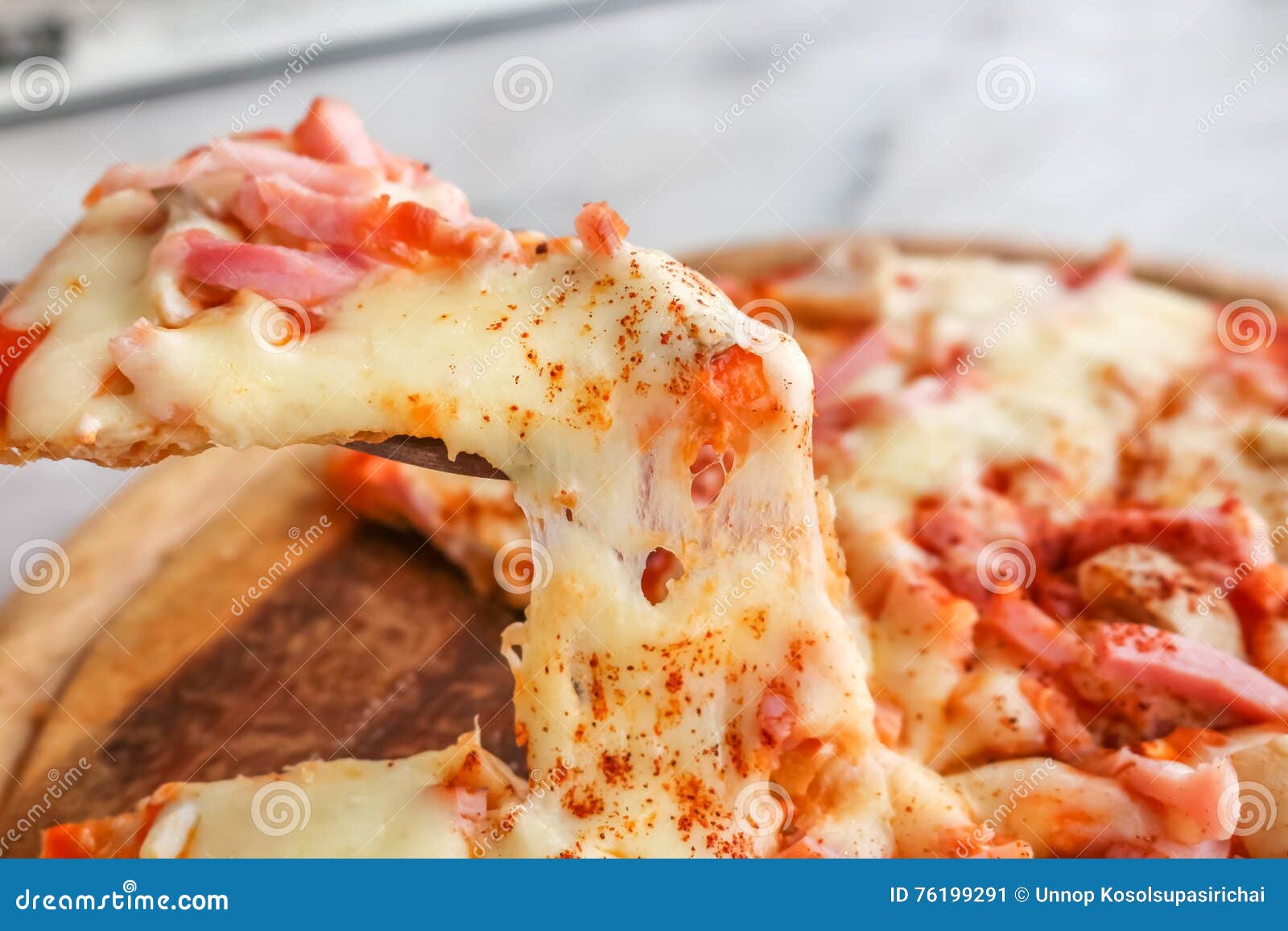 Hot Pizza Slice with Melting Cheese on a White Granite Stone Table ...