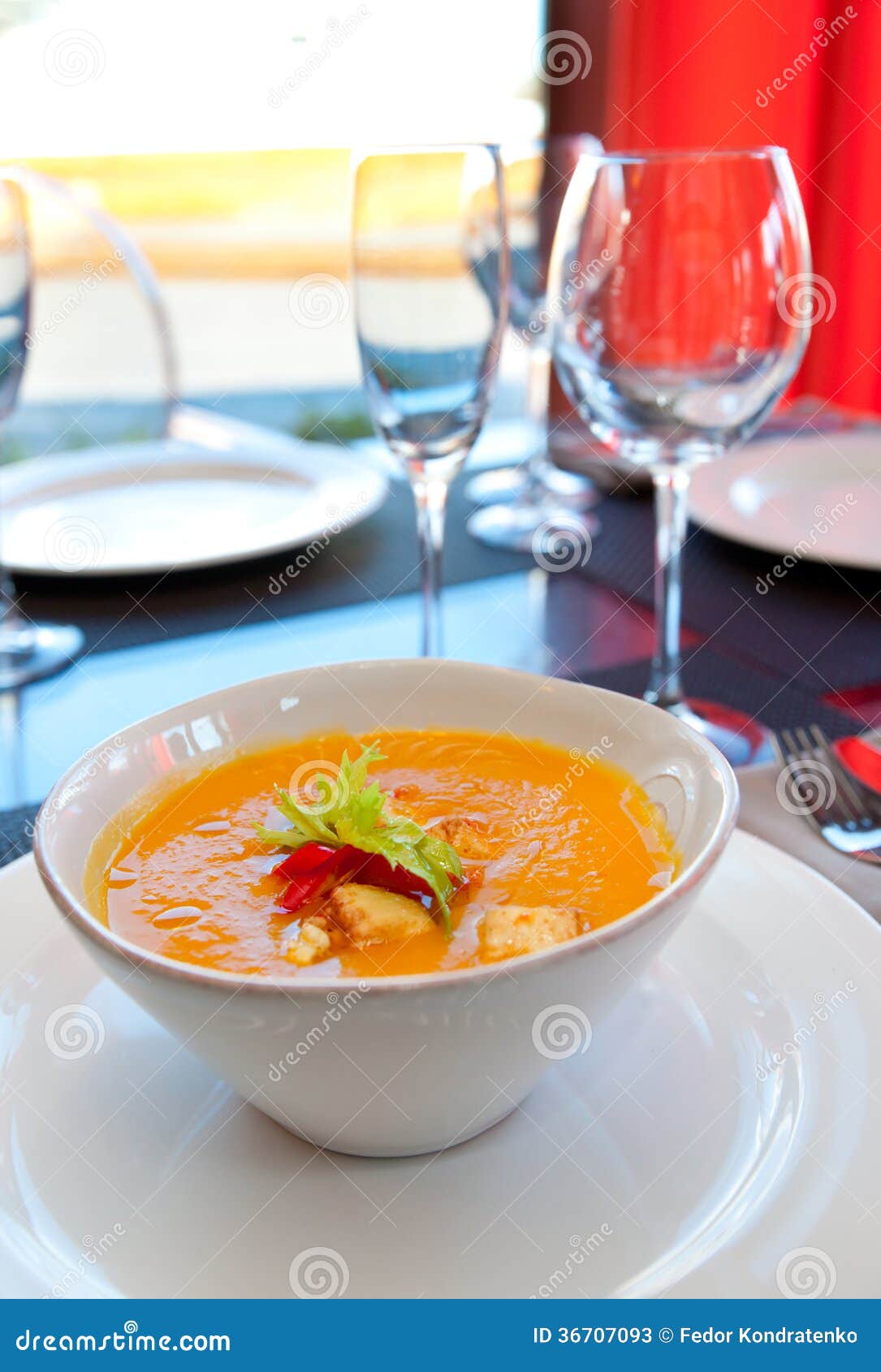 Hot pumpkin soup on table stock image. Image of place - 36707093