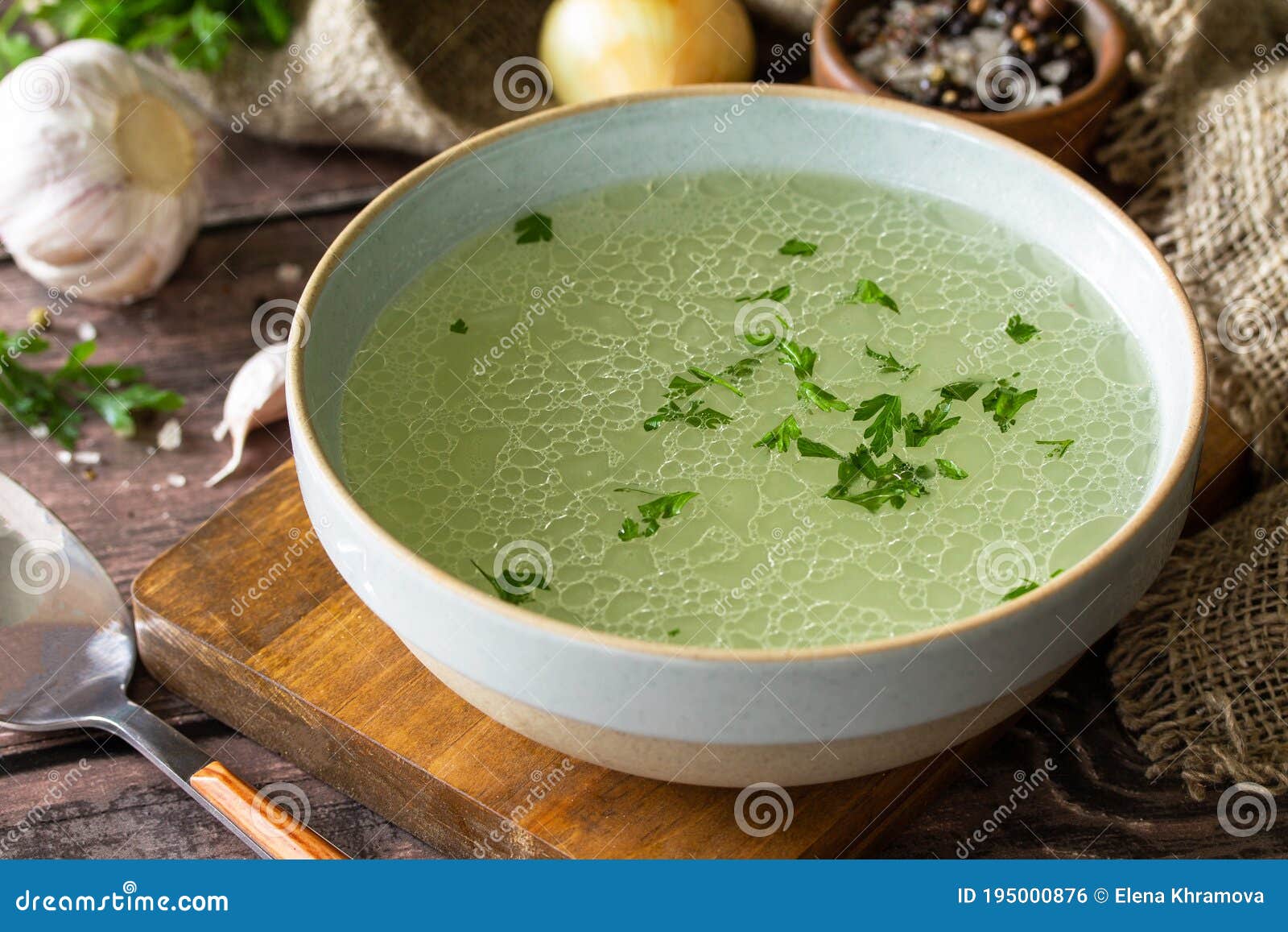 Hot Rich Meat Broth with Herbs on a Rustic Table Stock Photo - Image of ...