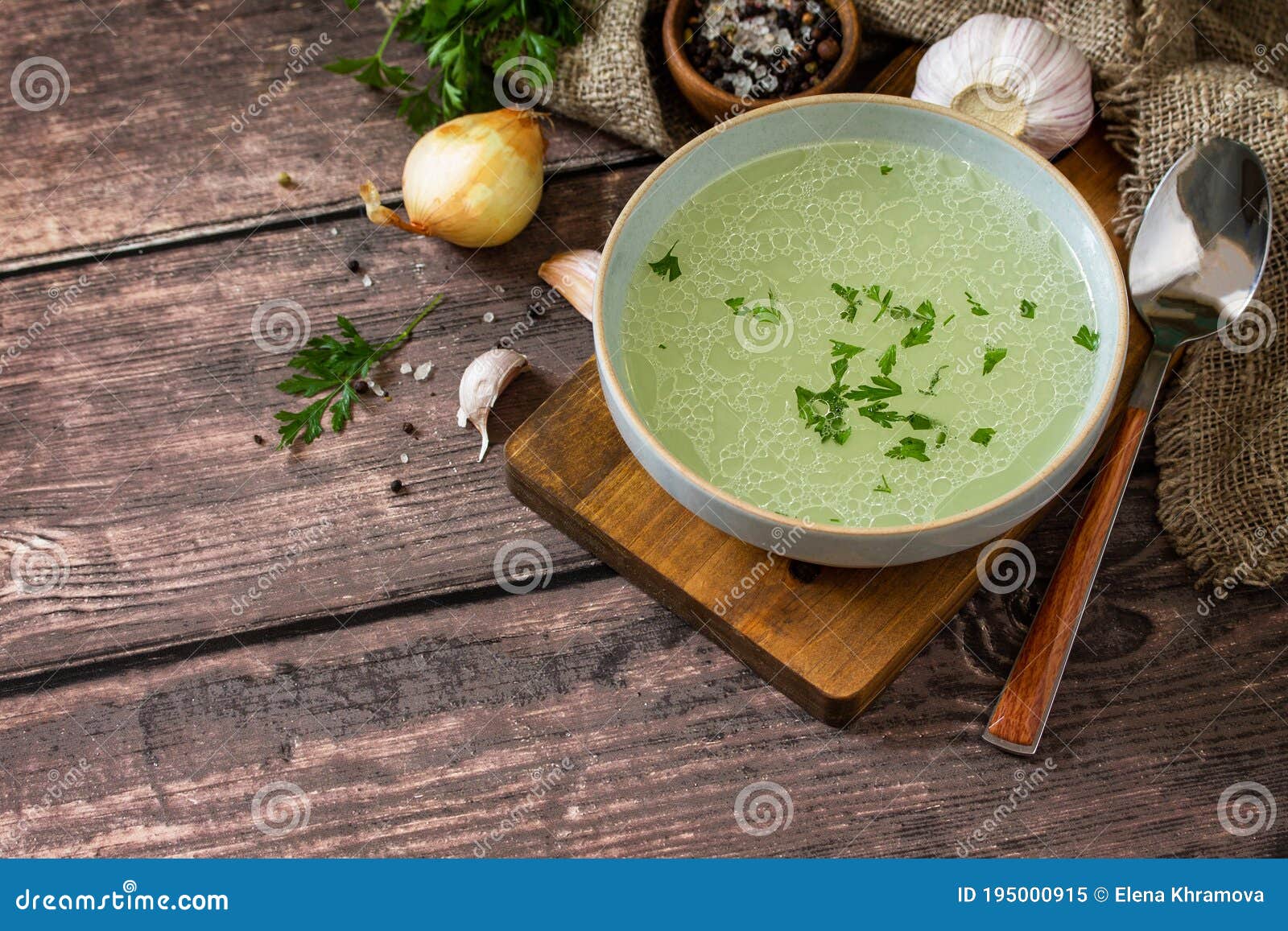 Hot Rich Meat Broth with Herbs on a Rustic Table. Copy Space Stock ...