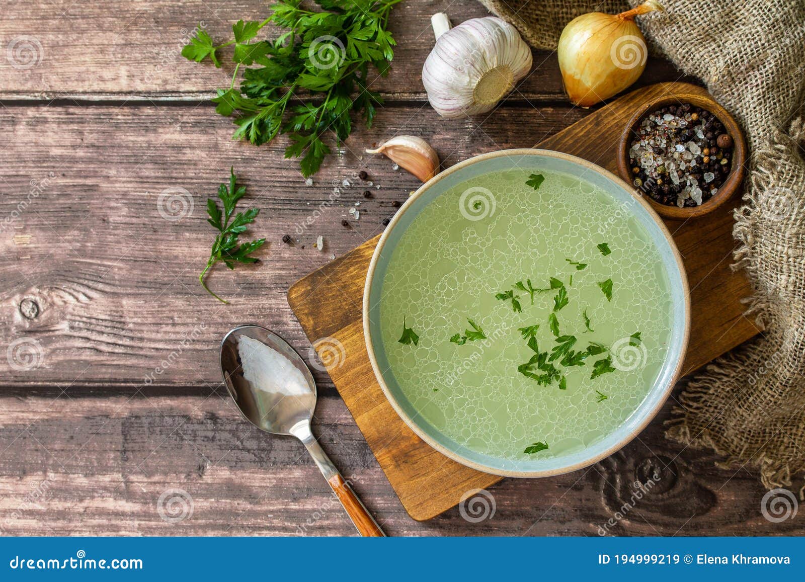 Hot Rich Meat Broth with Herbs on a Rustic Table. Top View Flat Lay ...