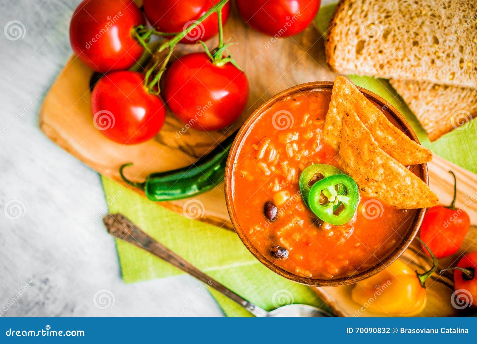 Hot and Spicy Fresh Made Mexican Chili Soup on Rustic Background Stock ...
