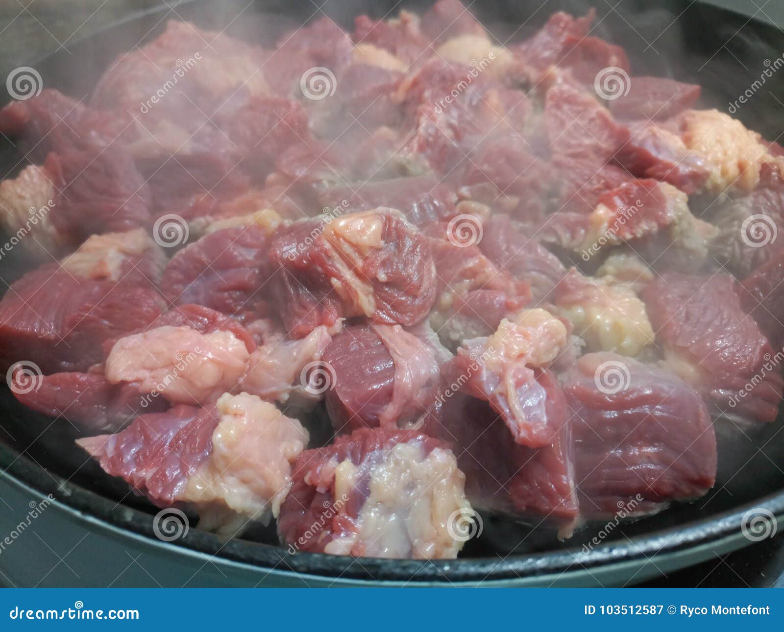 Steaming Raw Diced Beef in a Ceramic Pan Stock Image - Image of ...