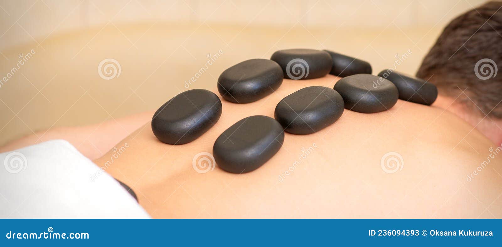 Hot Stone Massage Therapy Caucasian Young Man Getting A Hot Stone