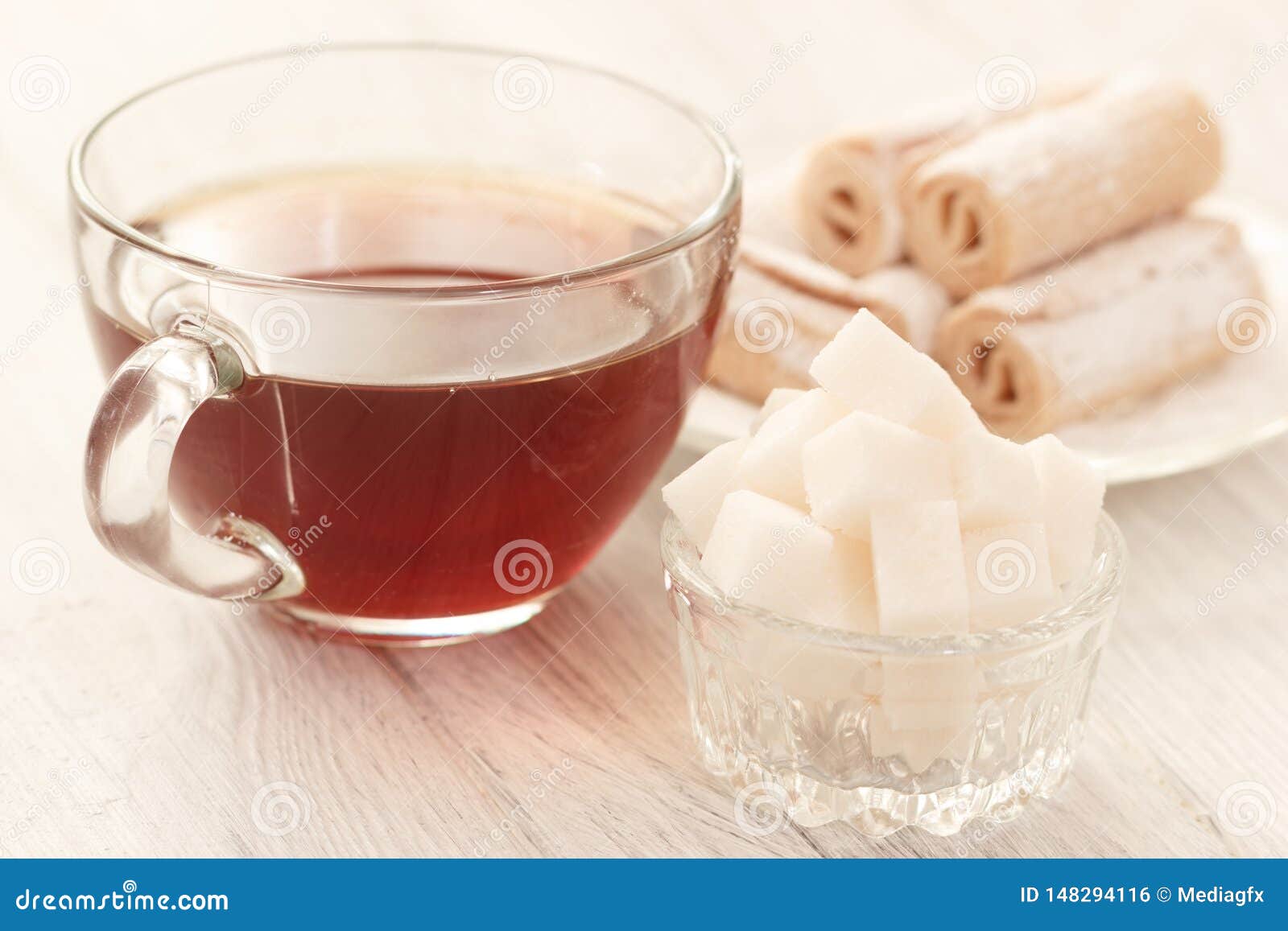 Hot Tea with Sugar Cubes and Sweets on Table Stock Photo - Image of ...