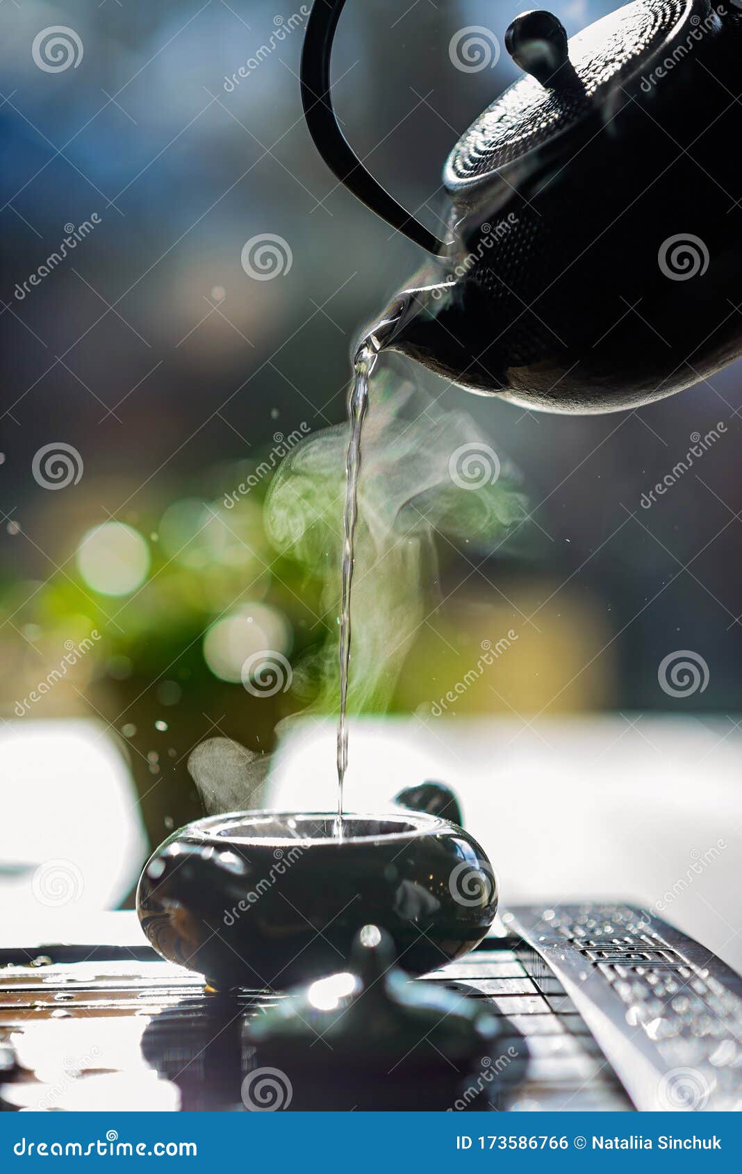 Hot Tea in a Teapot Pours Tea with Steam into a Cup. Tea Ceremony Stock ...