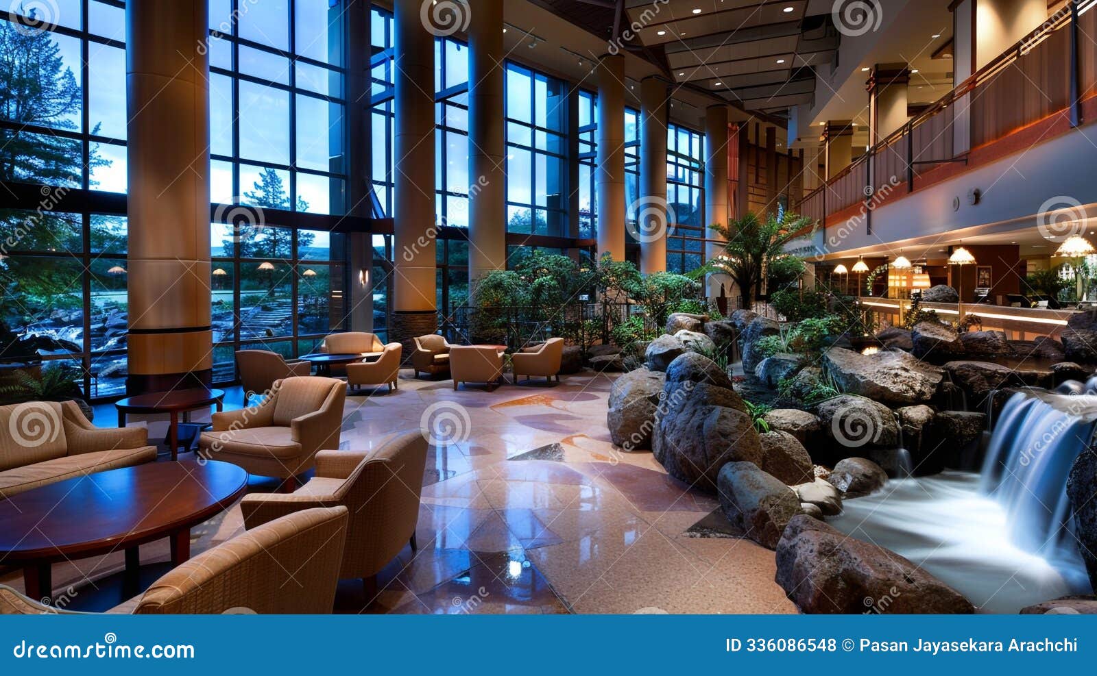 Hotel Lobby Features Panoramic Windows and Lounge Seating with a ...