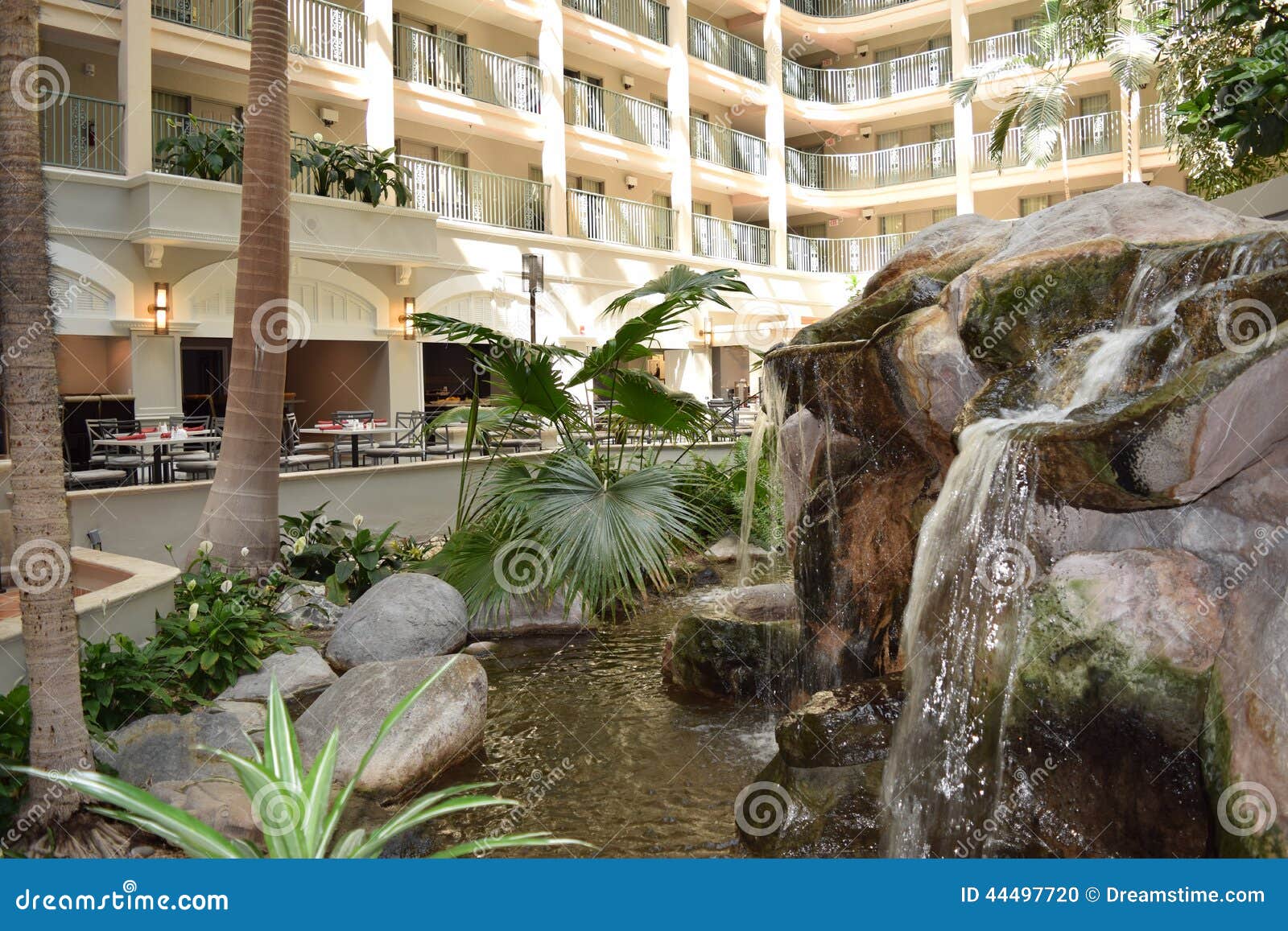 Hotel lobby with waterfall stock photo. Image of lobby - 44497720