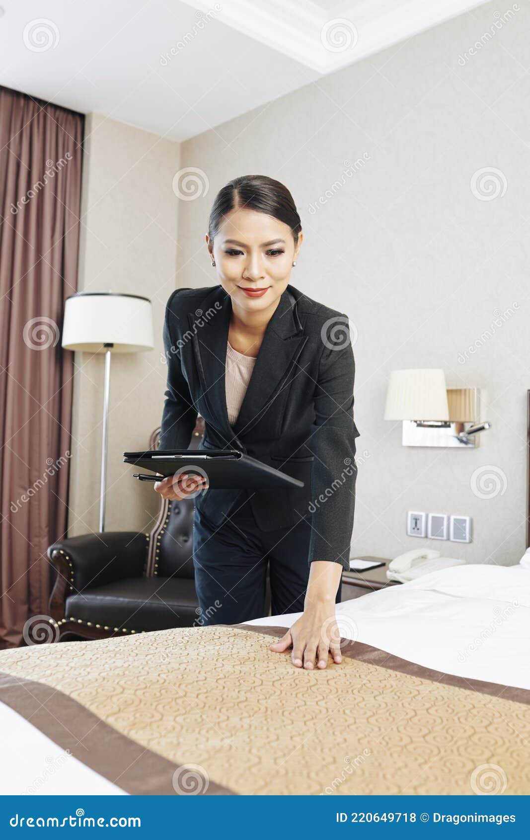 Hotel Manager Checking Bedding in Room Stock Photo - Image of ...
