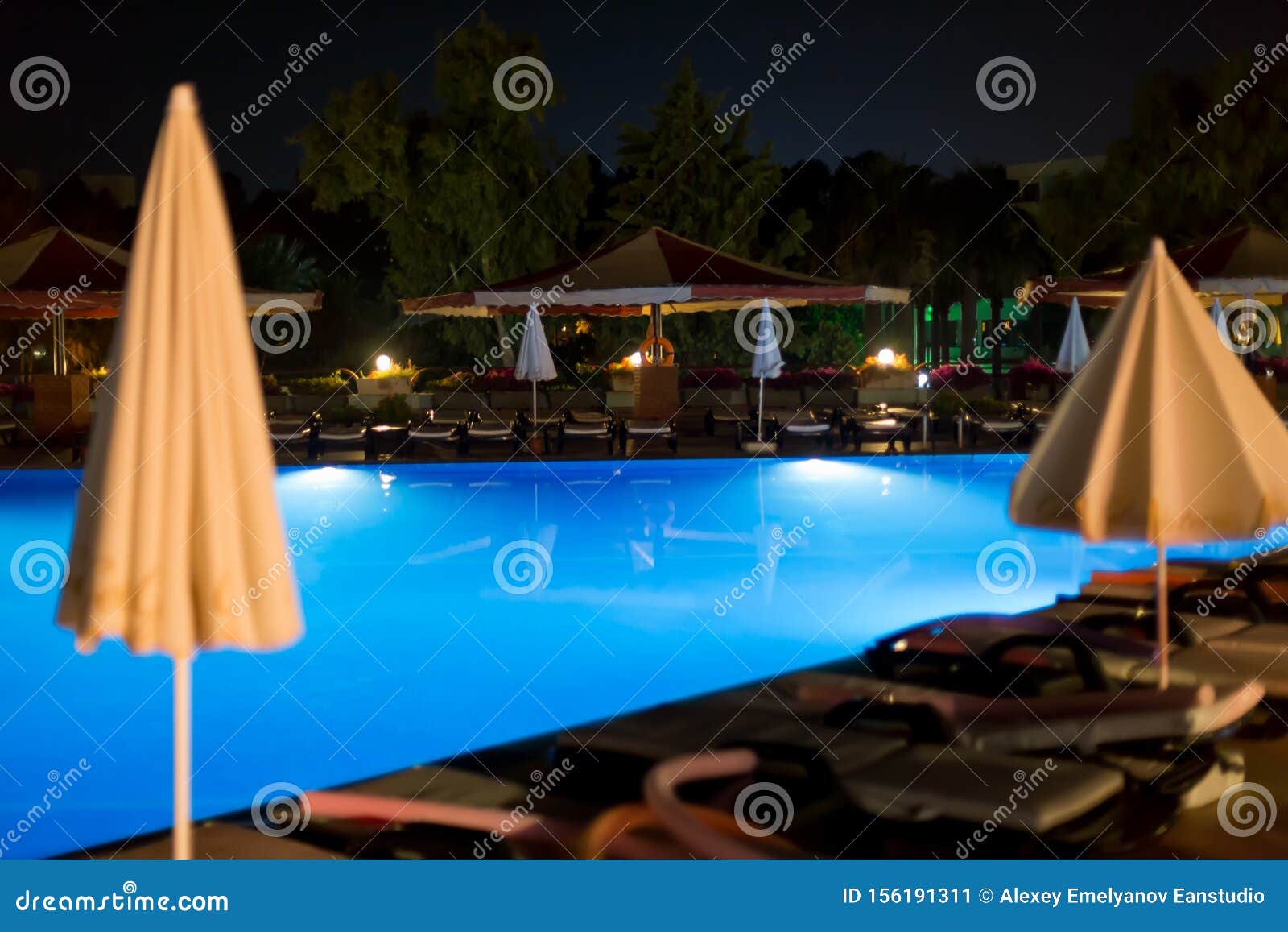 Hotel Outdoor Pool at Night Stock Image - Image of reflective ...