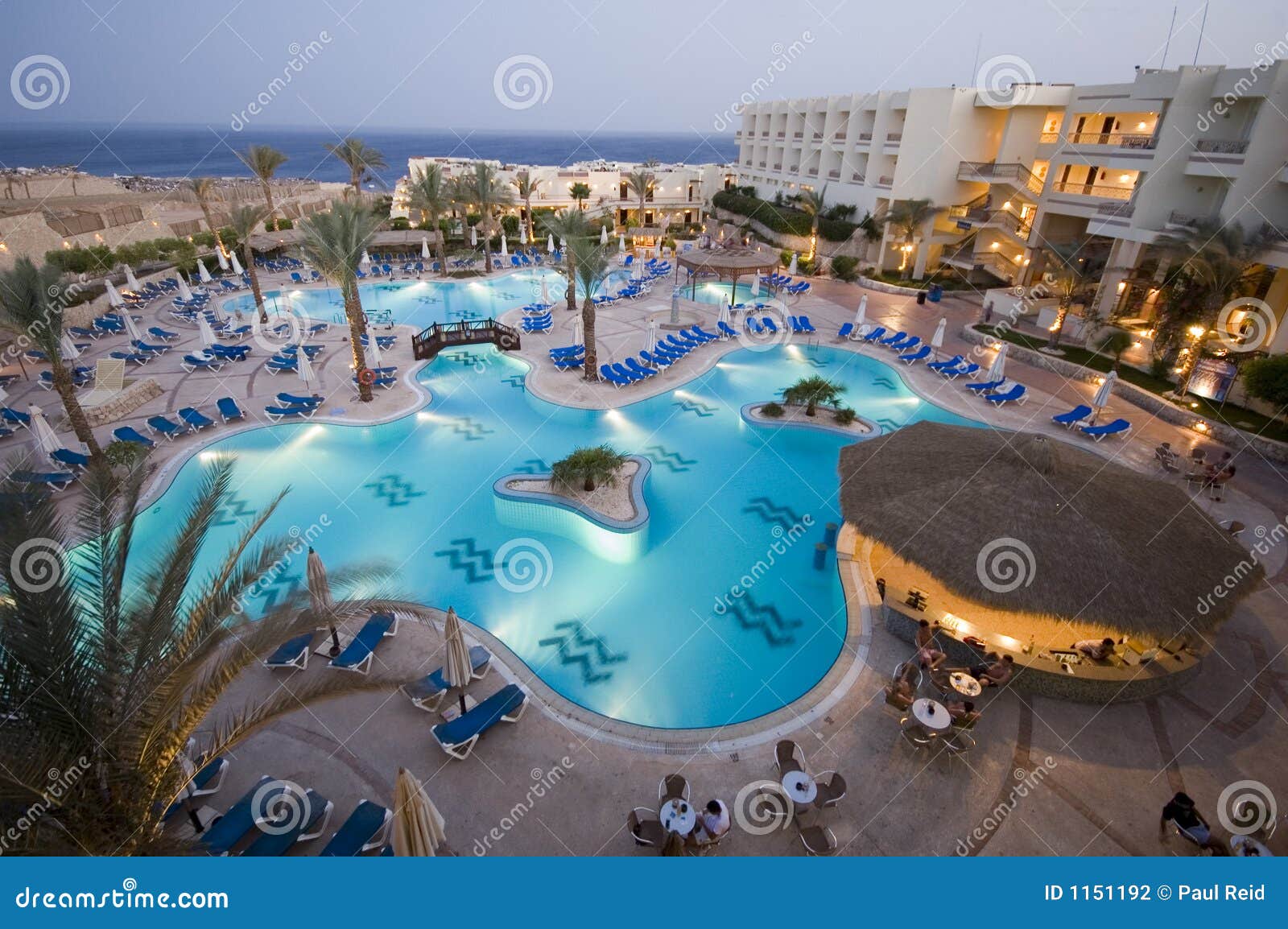 Hotel pool at dusk on stock photo. Image of relax, ocean - 1151192