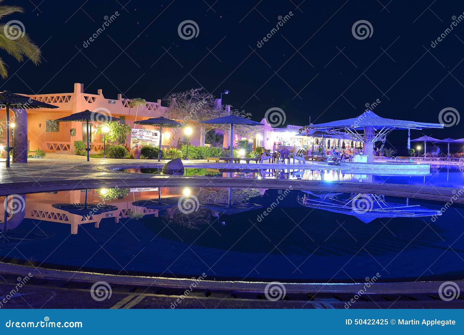 Hotel pool at night stock image. Image of reflection - 50422425