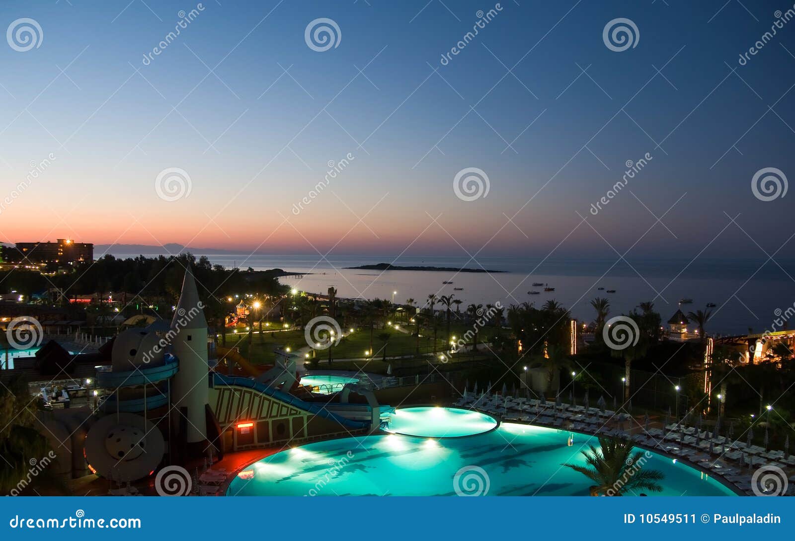 Hotel pool view at night stock image. Image of blue, luminosity - 10549511